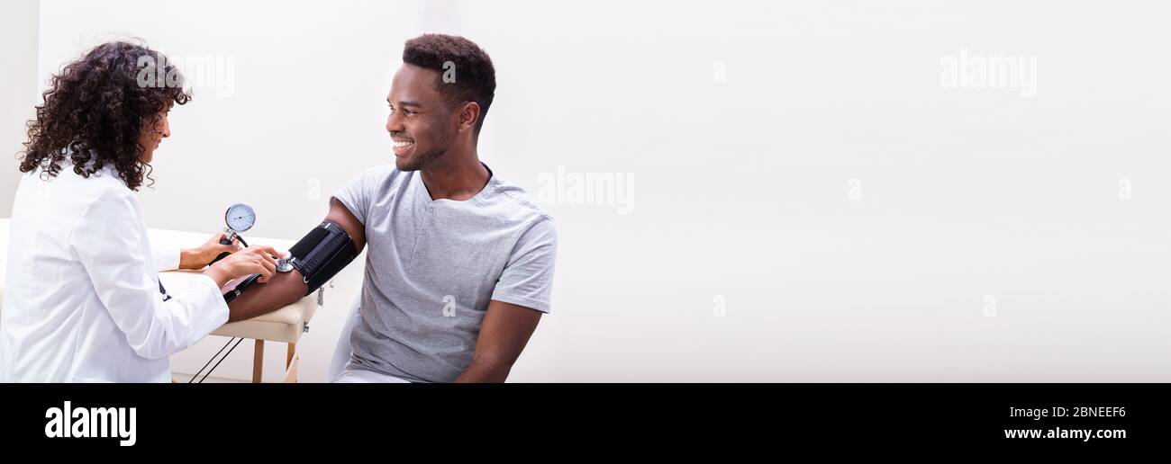 African American Medical Check High Blood Pressure Stock Photo - Alamy
