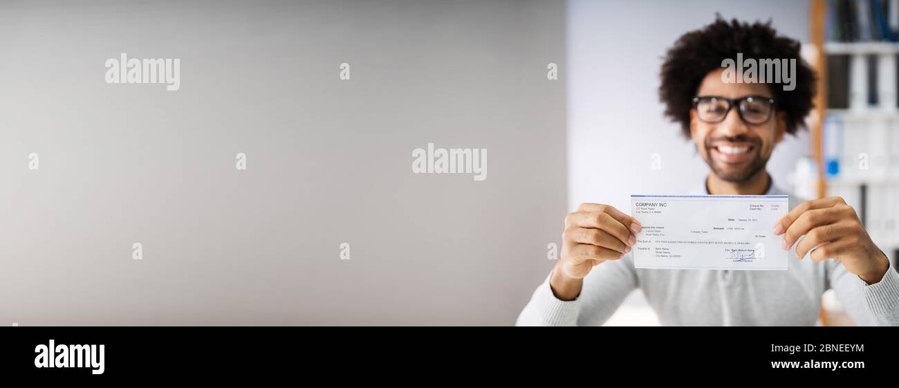 African American Person Holding Cheque. Money And Insurance Stock Photo ...