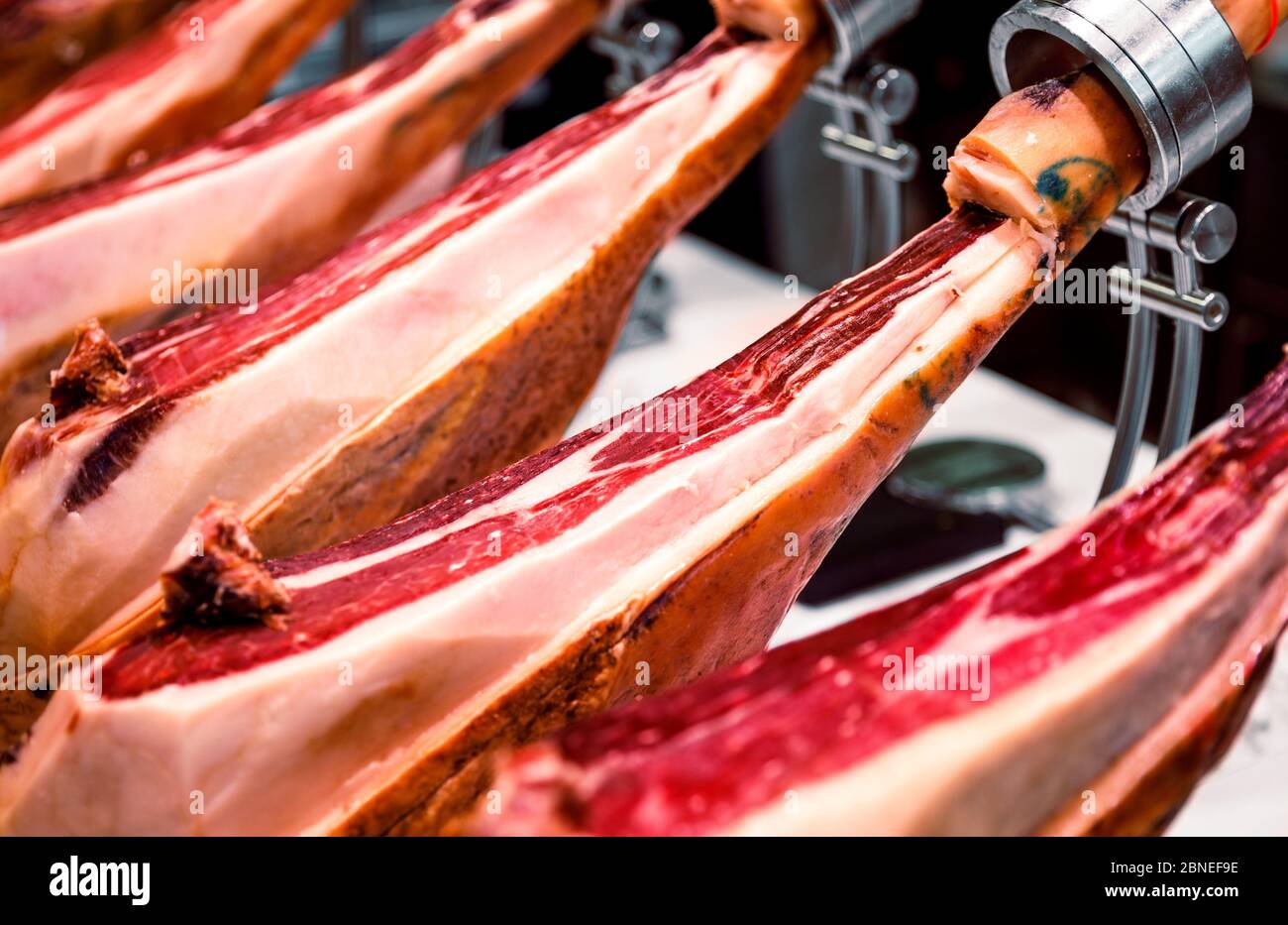 Famous ripened Spanish iberico ham in the Barcelona market Stock Photo ...