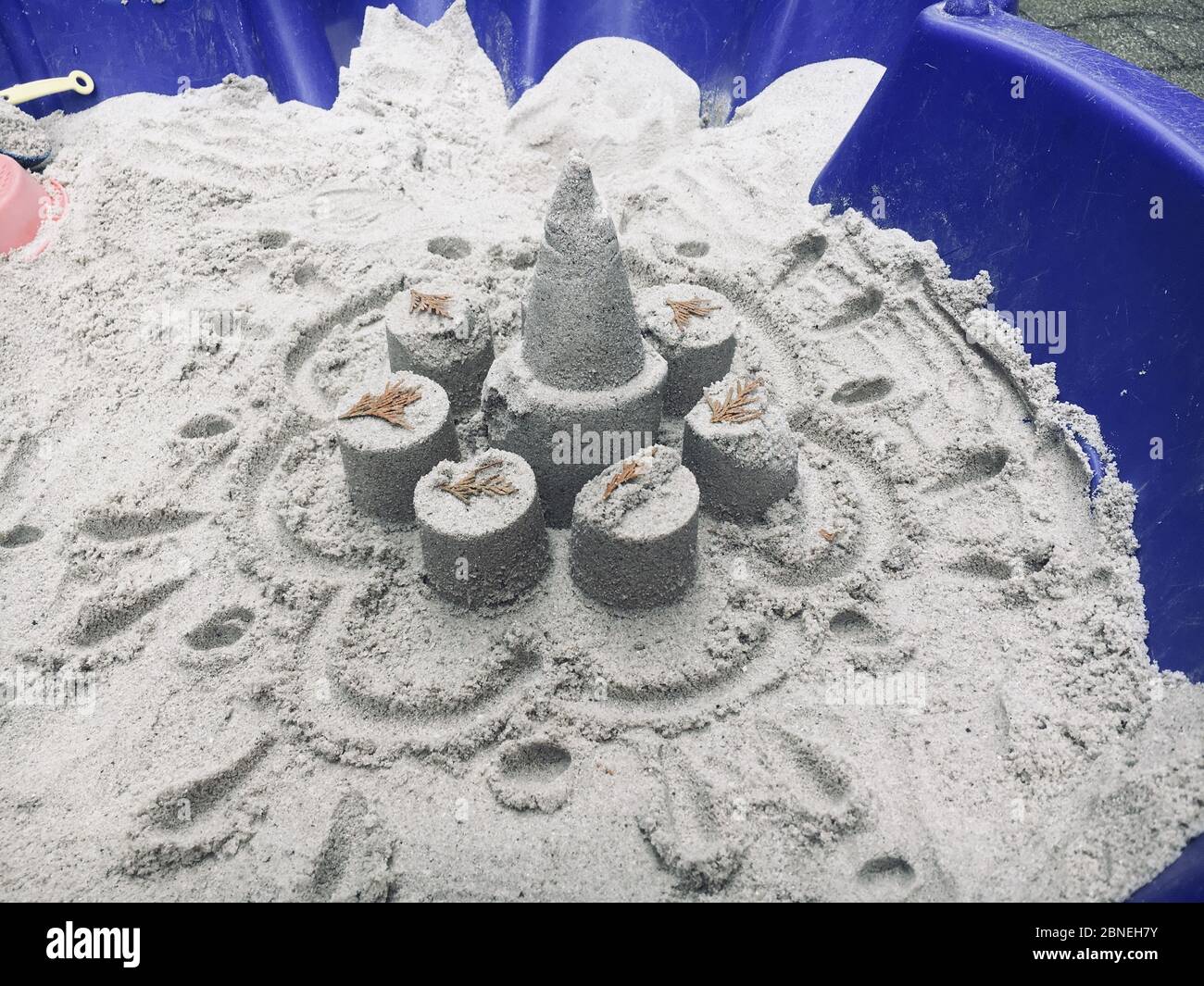 High angle shot of children's sand figure made with bucket mold in a ...