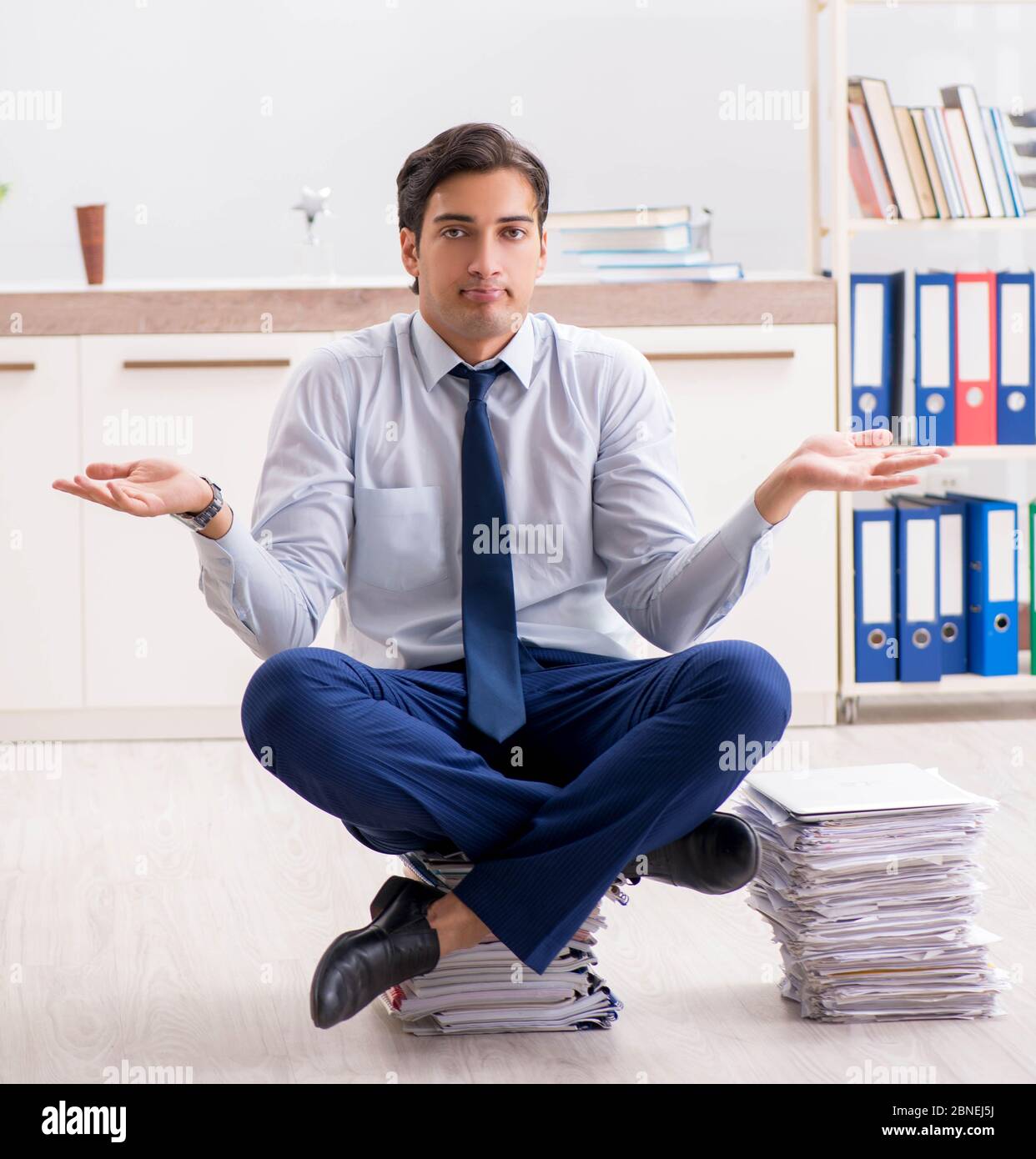 The extremely busy employee working in the office Stock Photo - Alamy