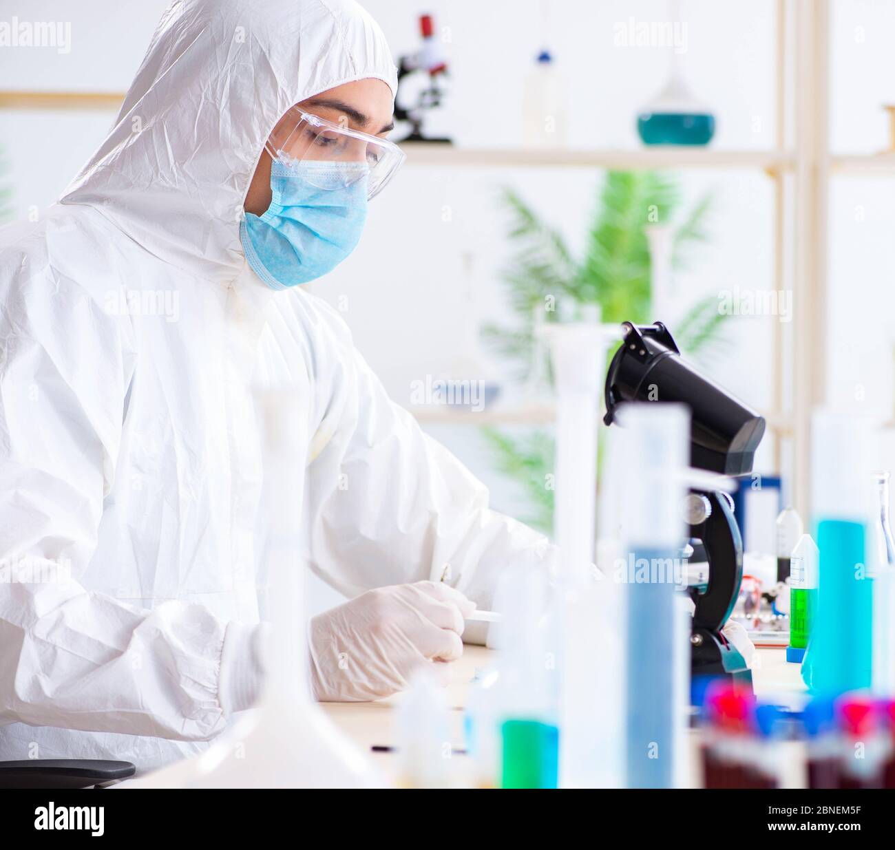 The young chemist student working in lab on chemicals Stock Photo - Alamy