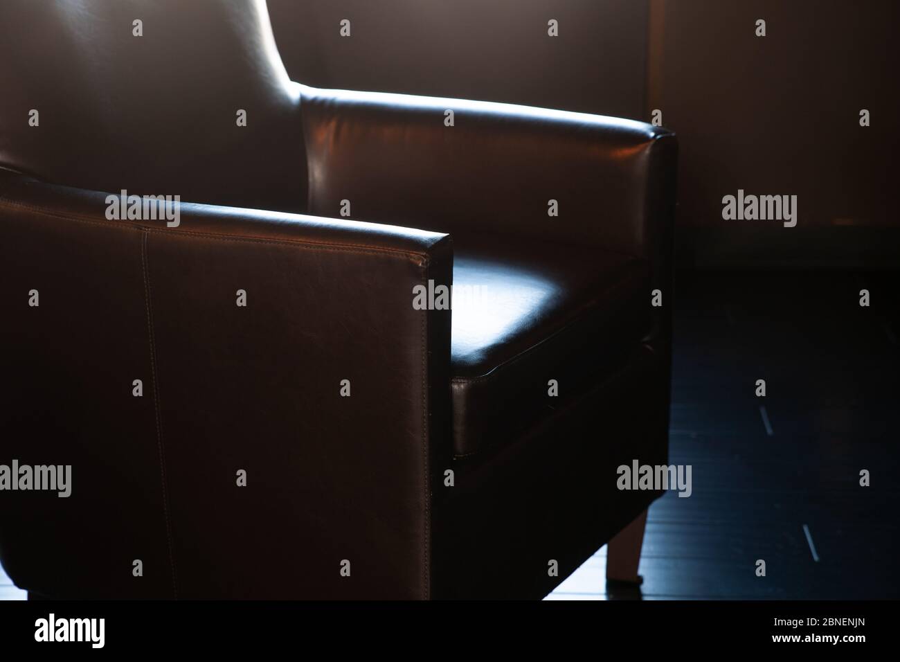 Dramatic dark lighting on comfortable office chair Stock Photo - Alamy