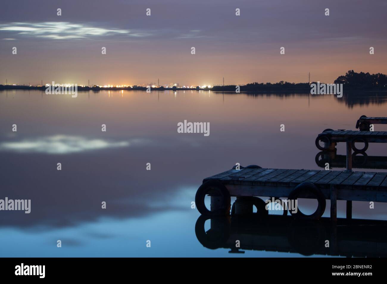 Beautiful scenery of wooden docks by the sea with the reflection of ...