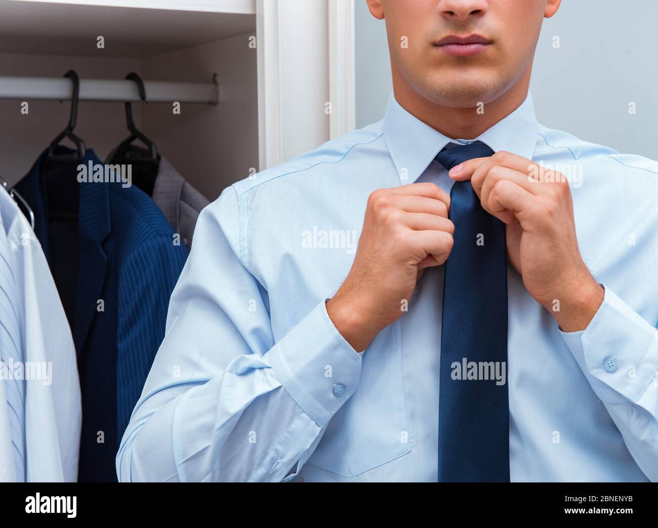 The businessman dressing up for work Stock Photo - Alamy