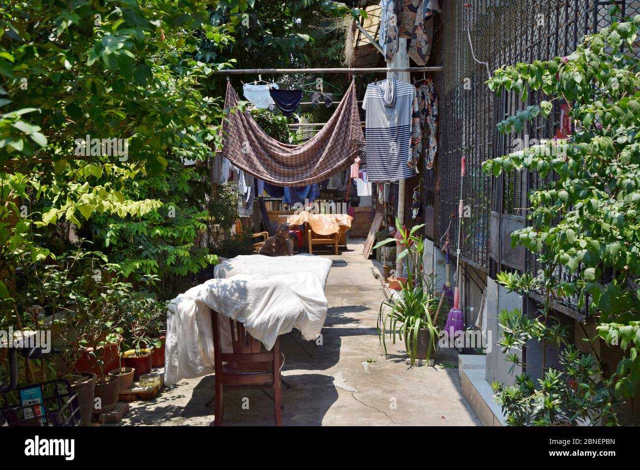 Hanging clothes under the sun, outside sun drying in the small ...