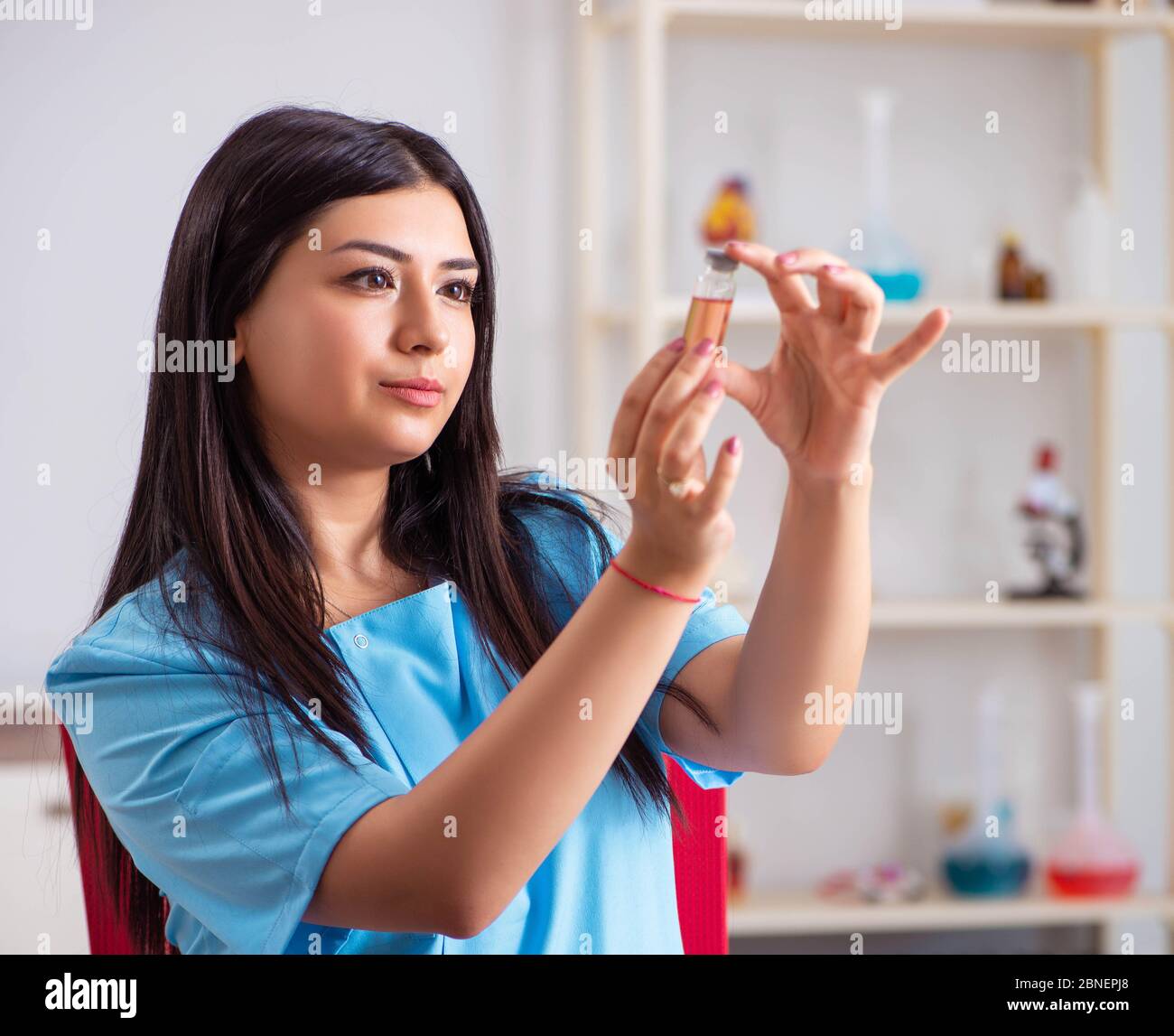 The young beautiful female doctor working in the clinic Stock Photo - Alamy