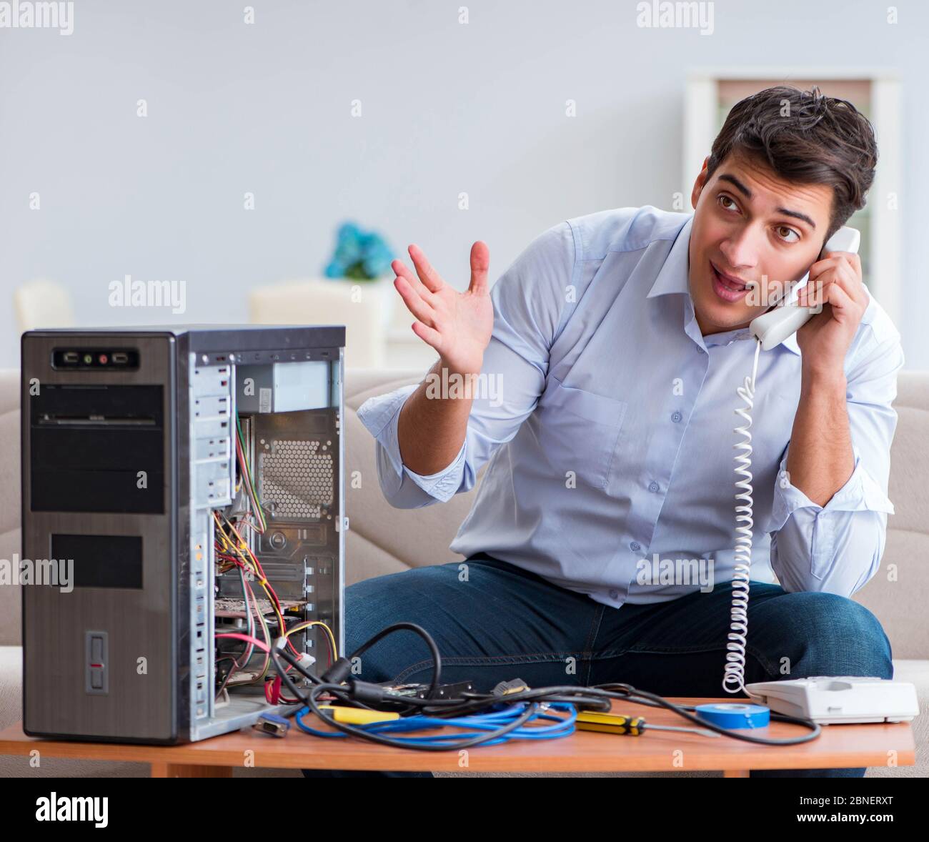 The angry customer trying to repair computer with phone support Stock ...