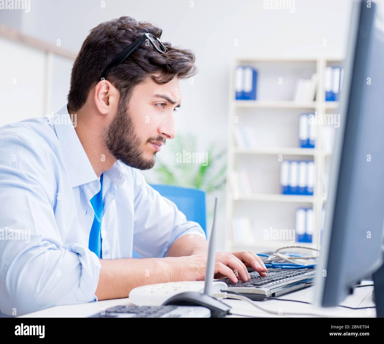 The it technician looking at it equipment Stock Photo - Alamy