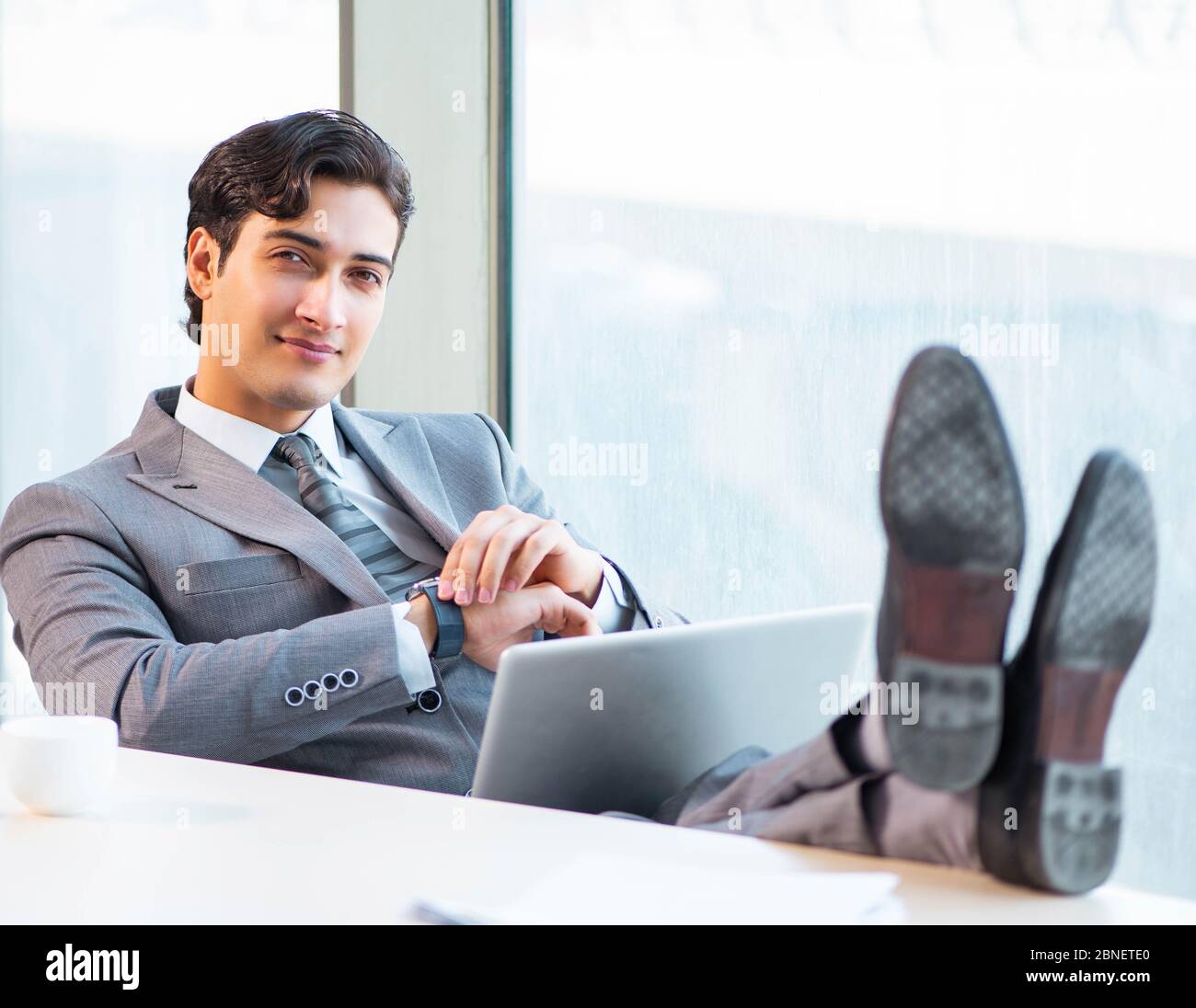 The young successful businessman working at the office Stock Photo - Alamy