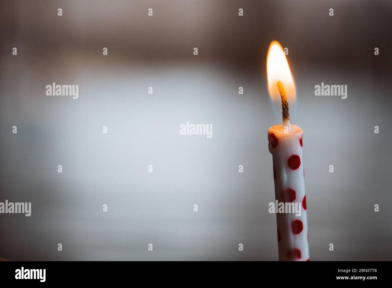Closeup of a birthday burning candle Stock Photo - Alamy