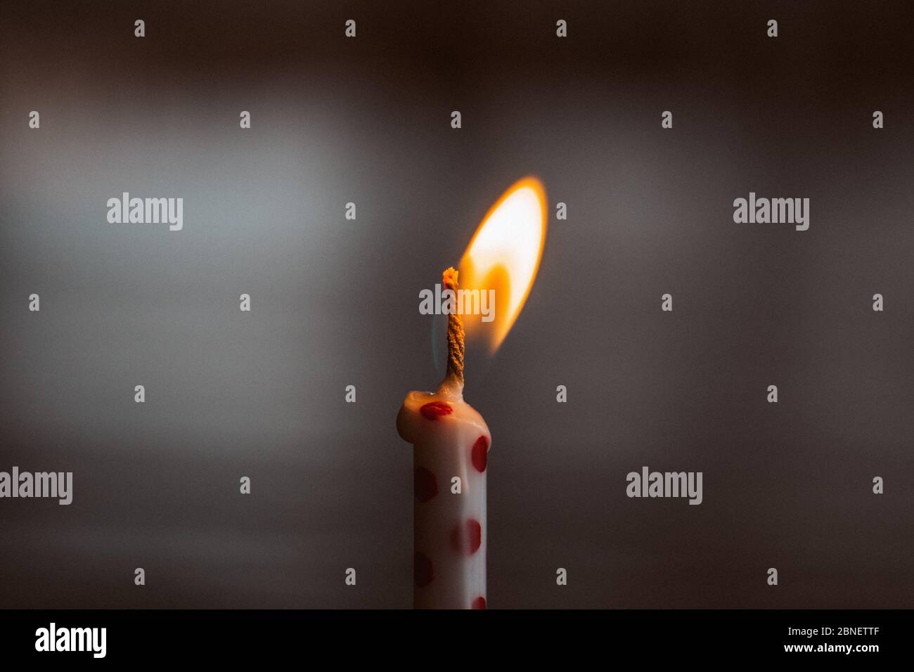 Closeup of a birthday burning candle Stock Photo - Alamy
