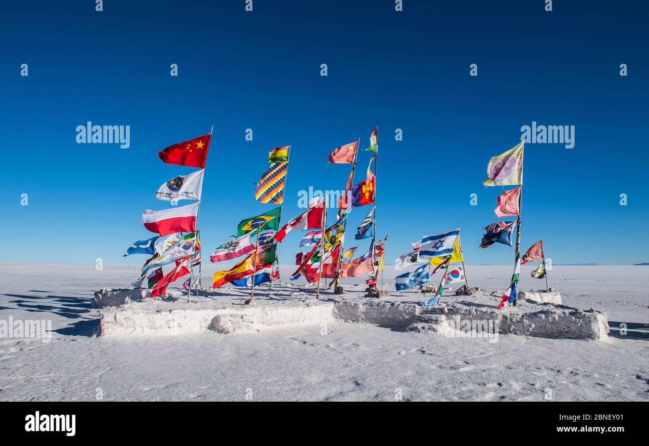 international flags planted on the salt flats of Uyuni in Bolivia Stock ...