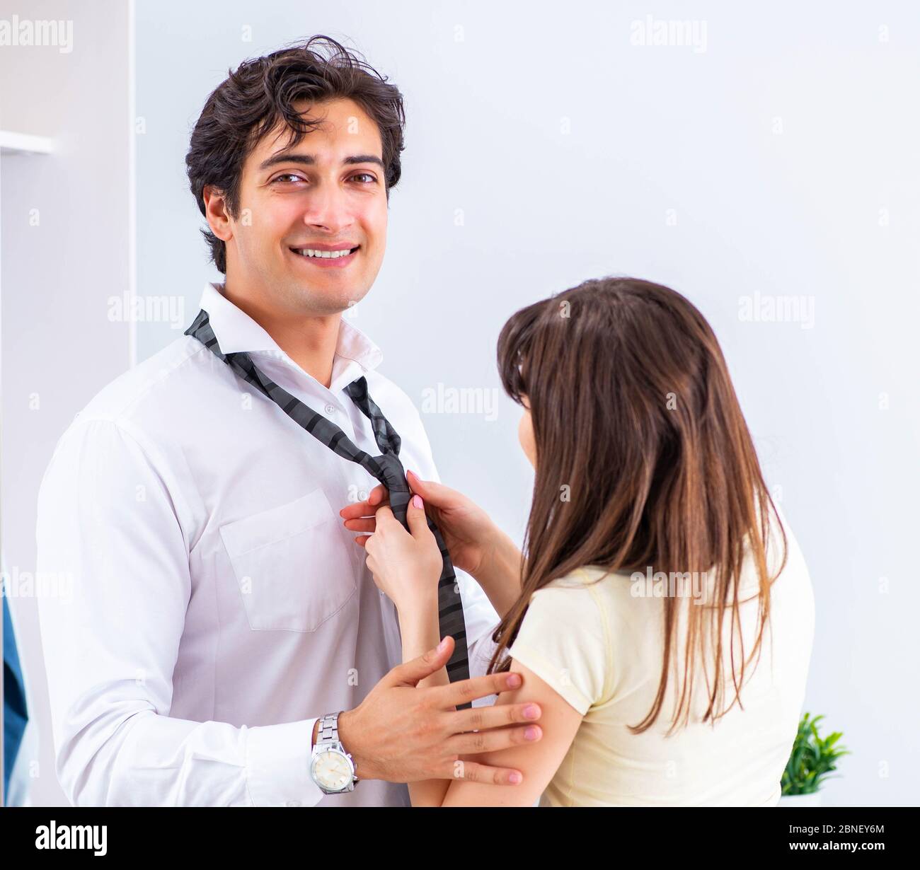 The woman sees her husband off to work Stock Photo - Alamy