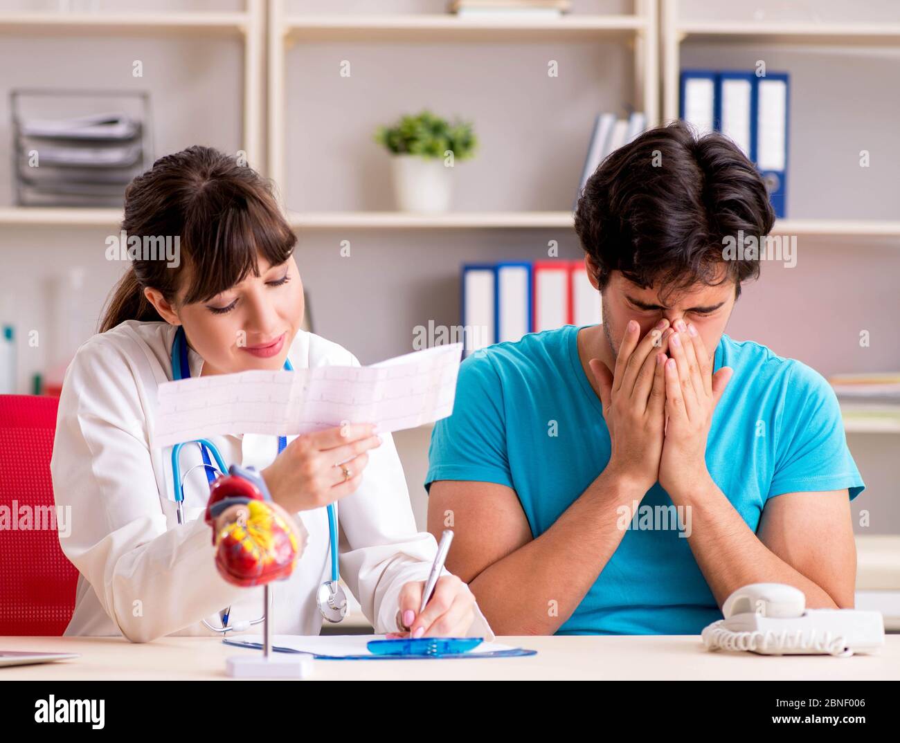 The young patient visiting doctor cardiologist Stock Photo - Alamy