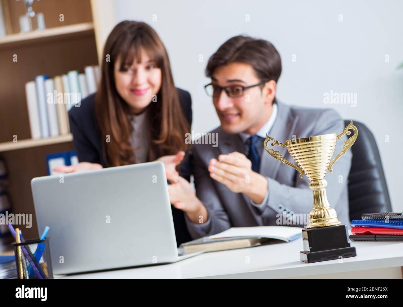 The concept of teamwork with prize Stock Photo - Alamy