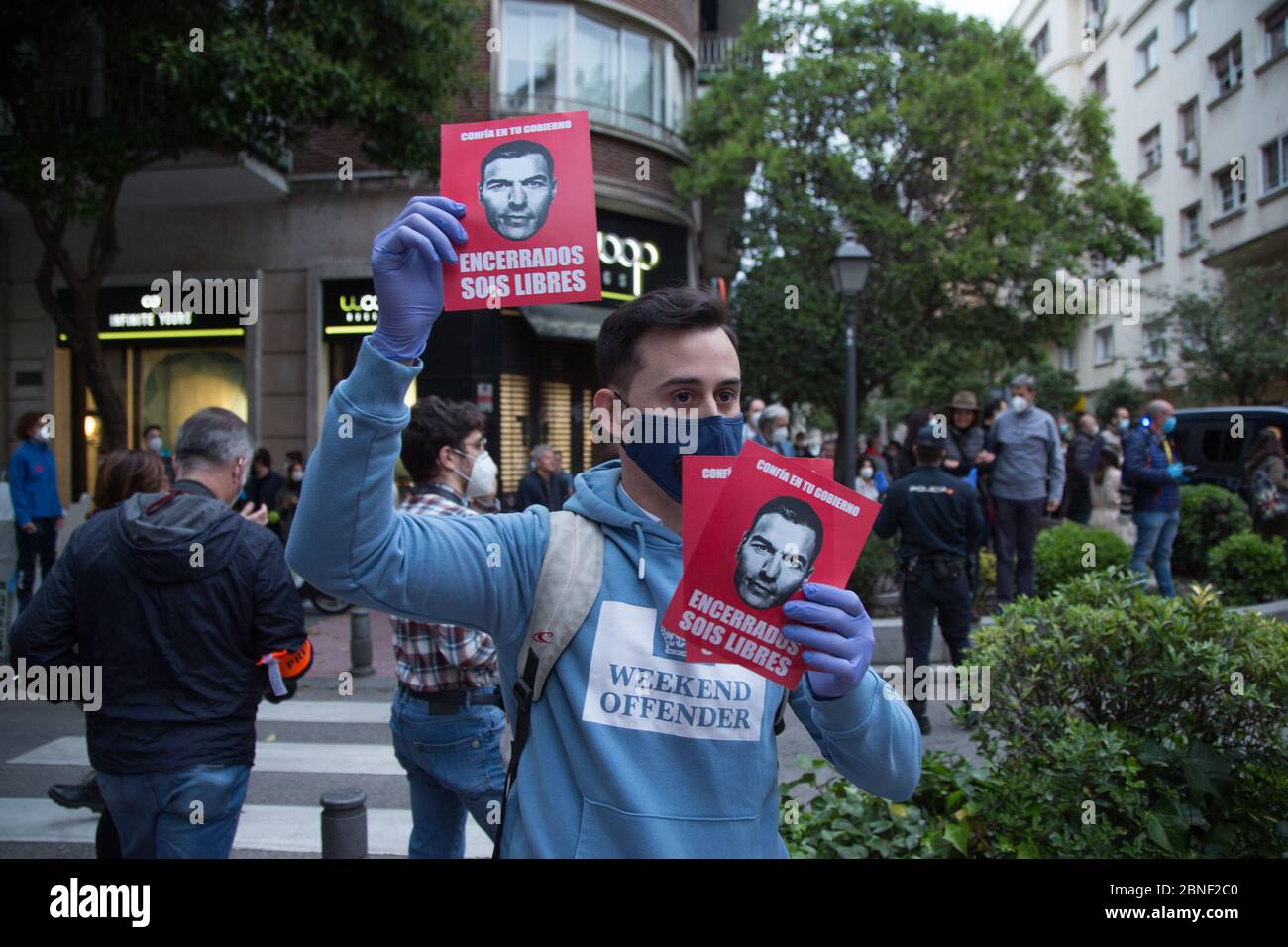 Madrid, Spain. 14th May, 2020. A boy distributes stickers against Pedro ...