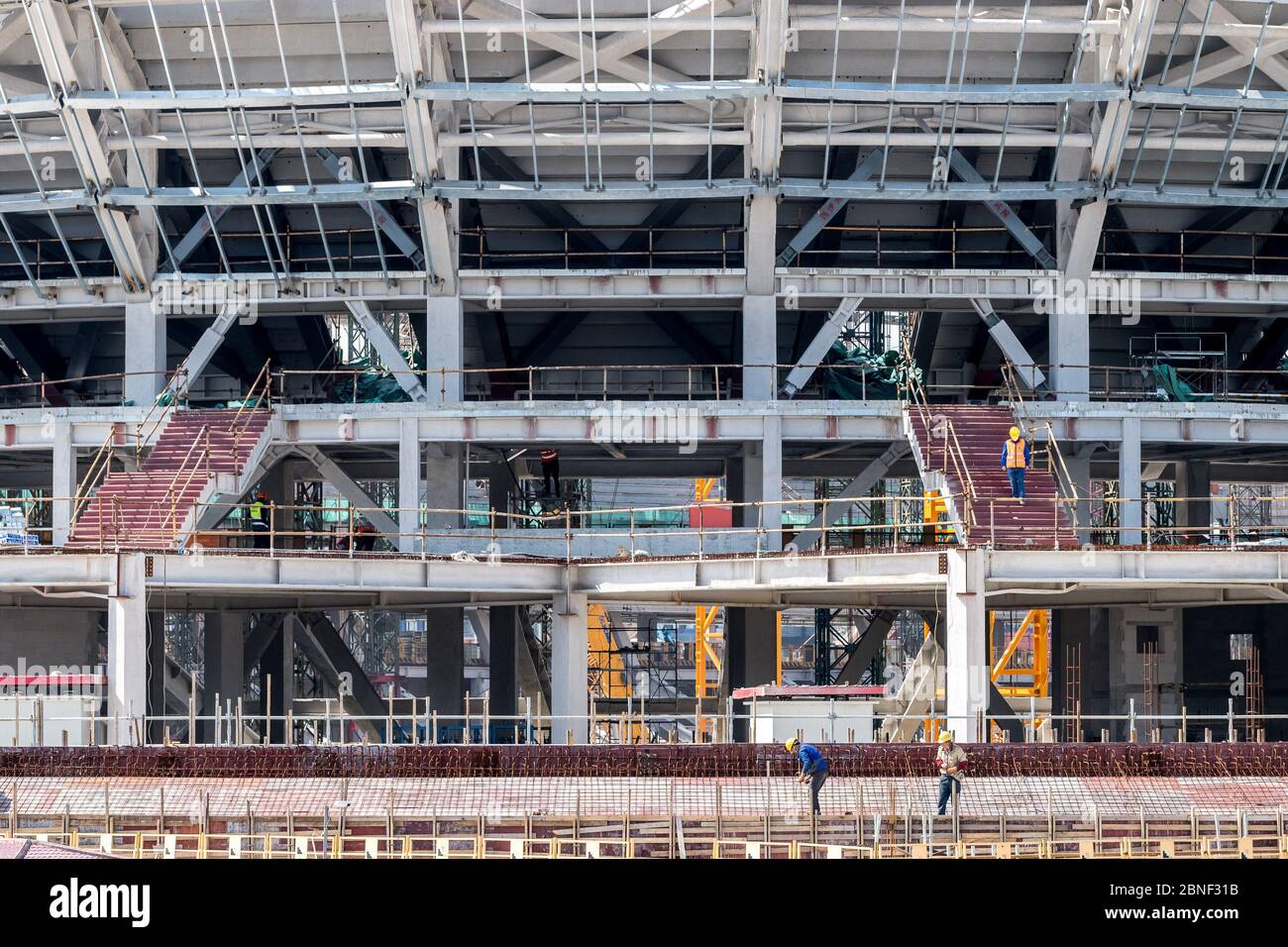 Workers are busy at constructing the Pudong Football Stadium, which ...