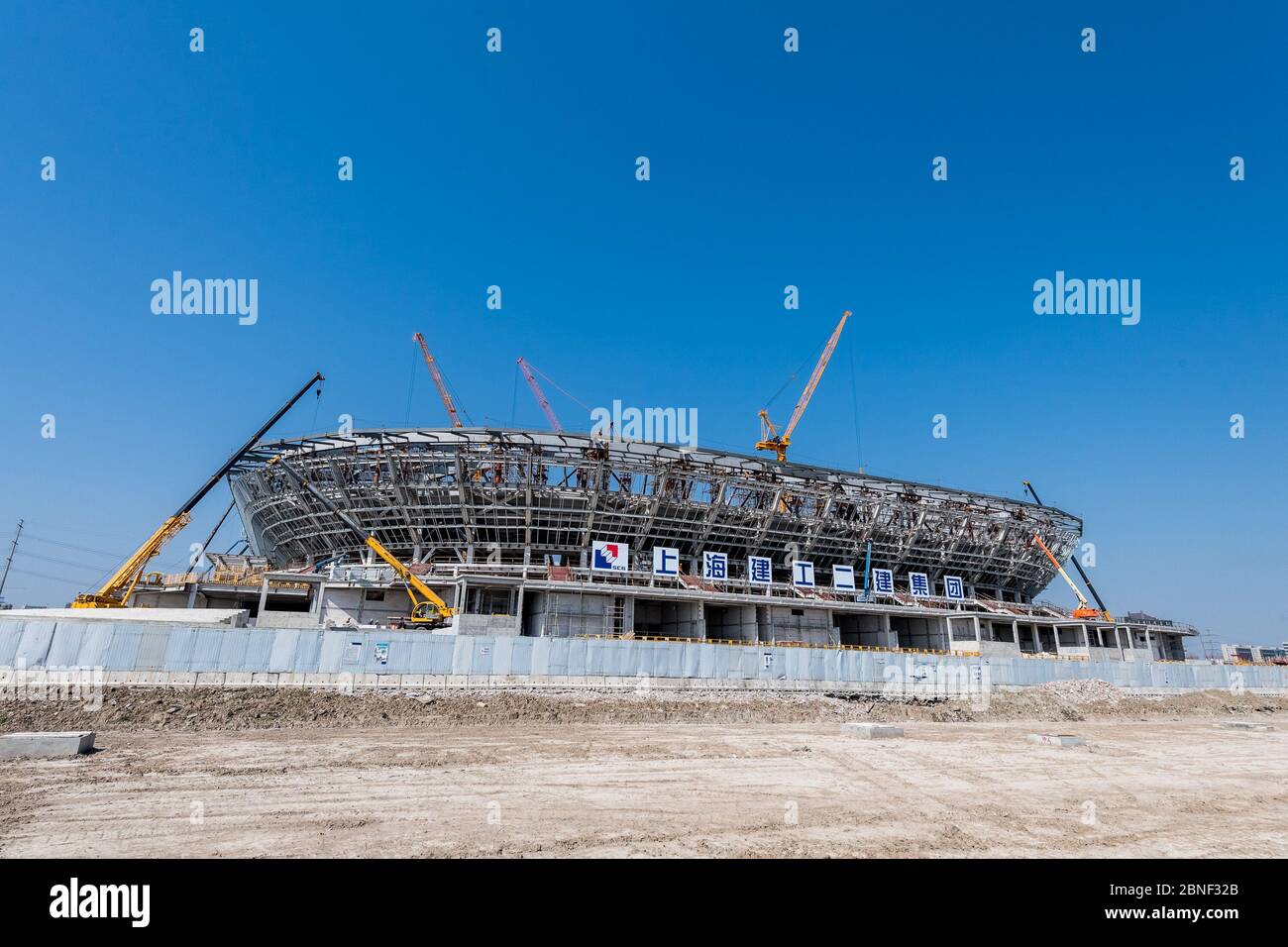 Workers are busy at constructing the Pudong Football Stadium, which ...