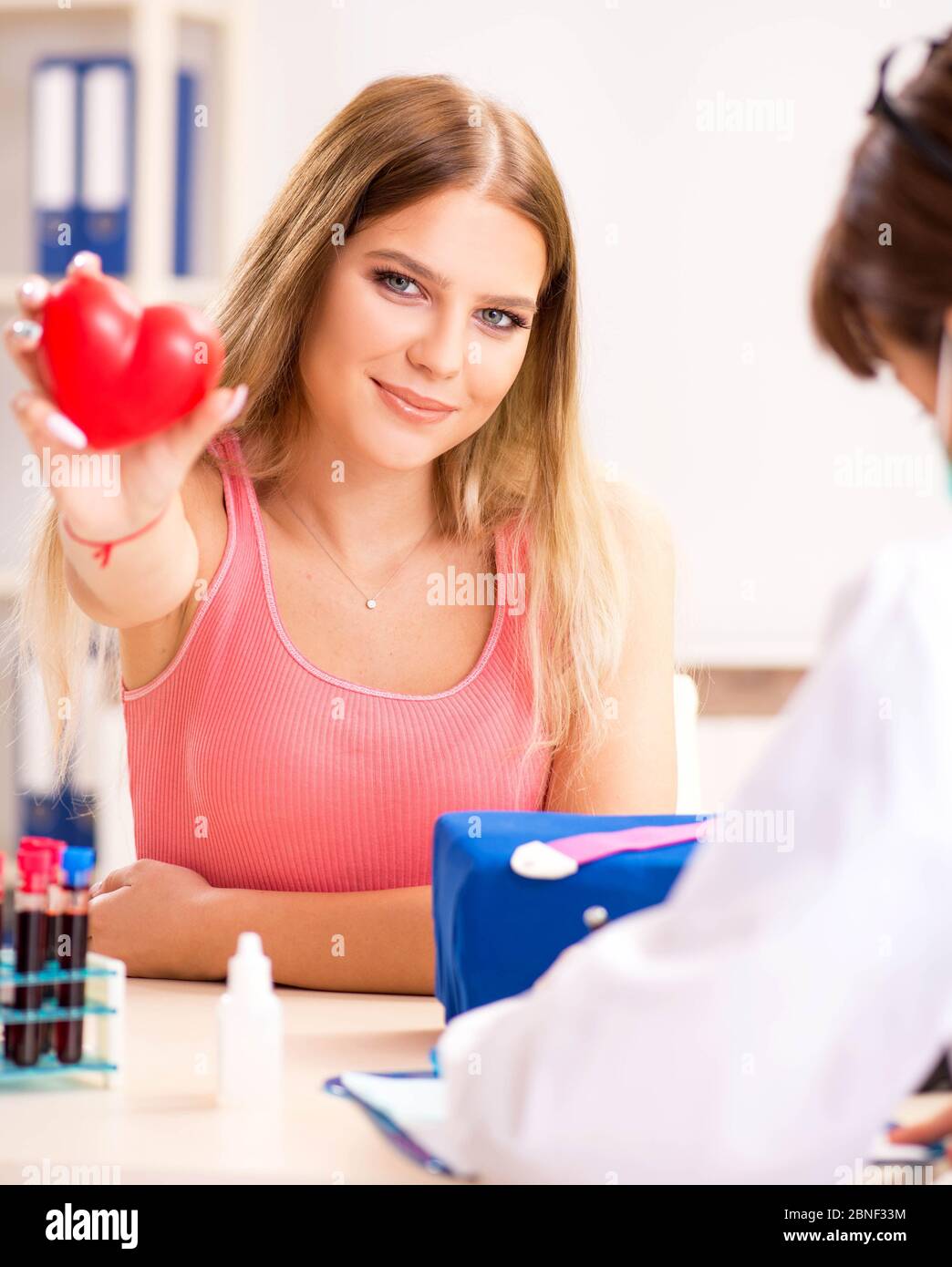 The young beautiful woman during blood test sampling procedure Stock ...