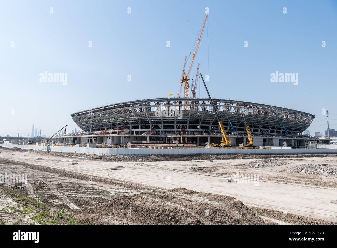 Workers are busy at constructing the Pudong Football Stadium, which ...