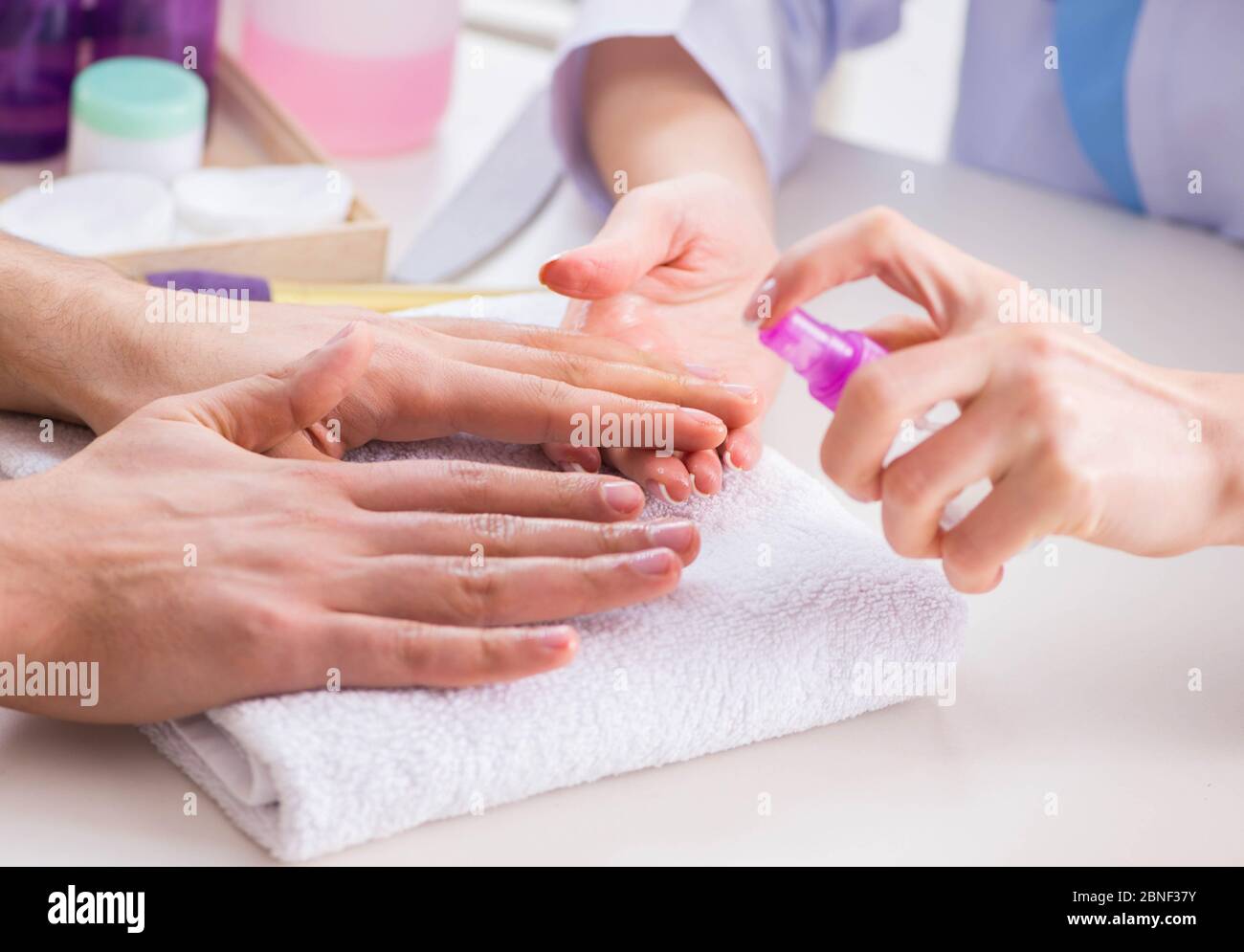Female hand manicure spraying hi-res stock photography and images - Alamy