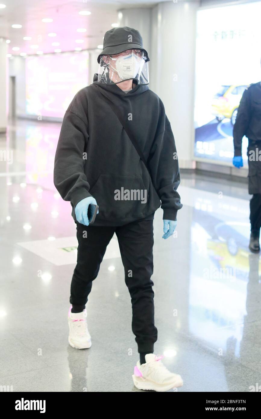 Chinese actress and singer Xu Dongdong arrives at a Beijing airport ...