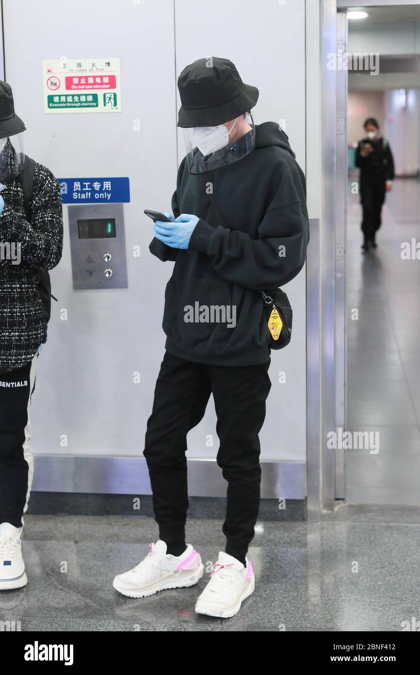 Chinese actress and singer Xu Dongdong arrives at a Beijing airport ...
