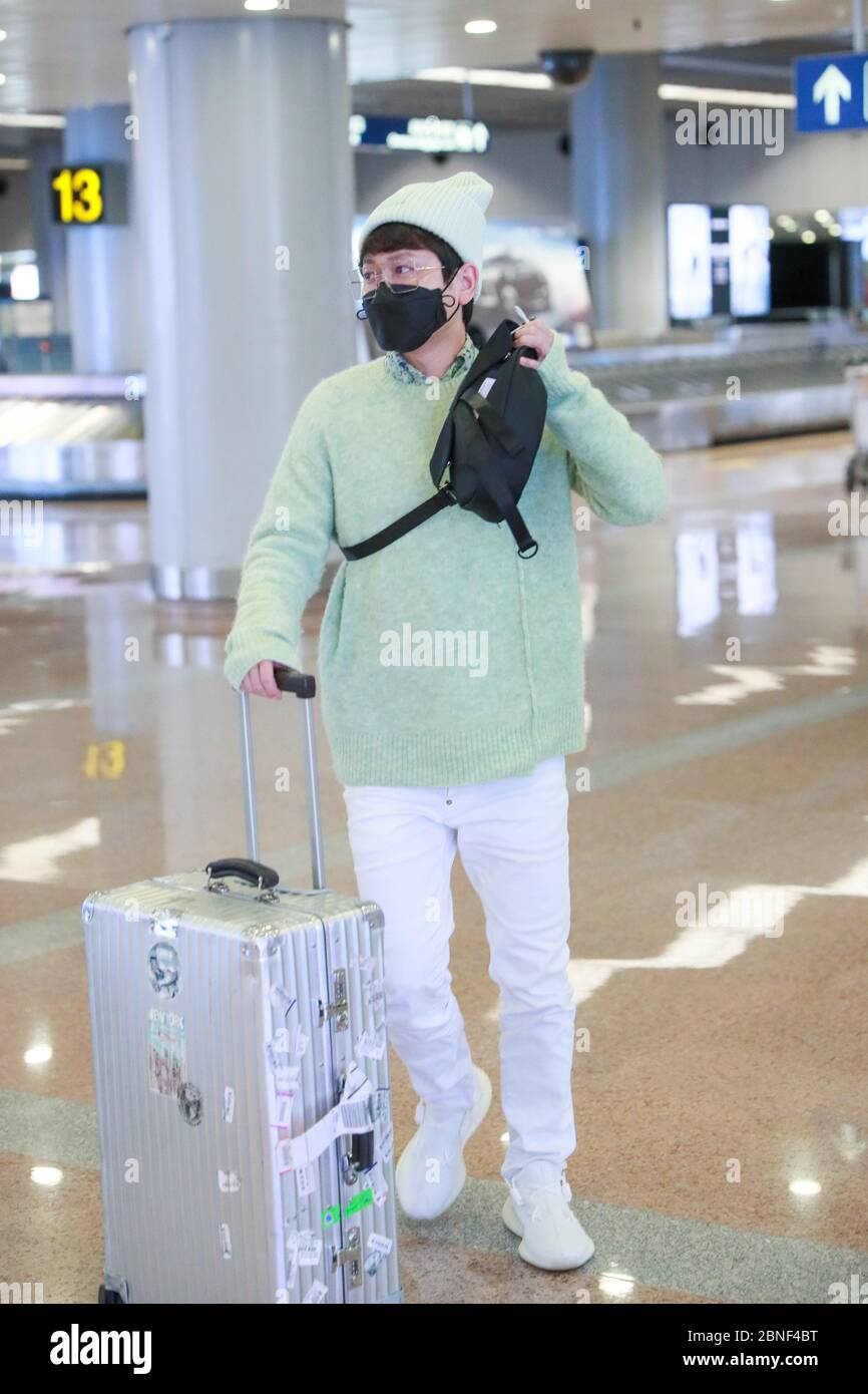 Chinese cross-talk actor Meng Hetang arrives at a Beijing airport ...