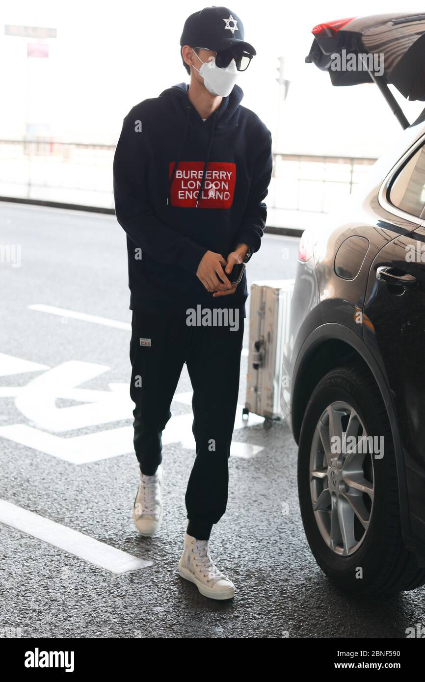 Chinese cross-talk comedian Qin Xiaoxian arrives at a Beijing airport ...