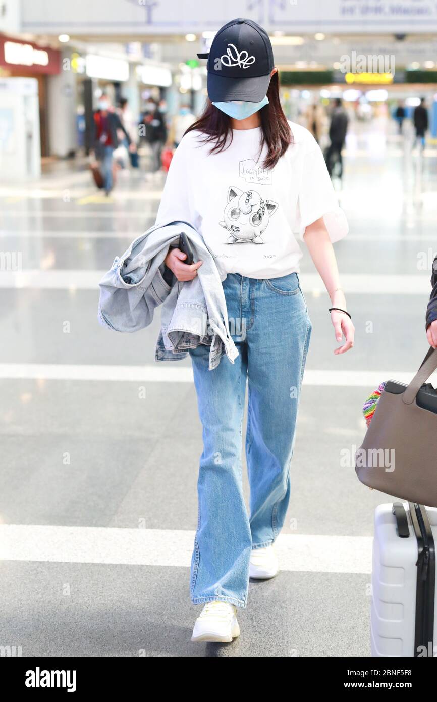 Chinese actress Chen Yuqi or Yukee Chen arrives at a Beijing airport ...
