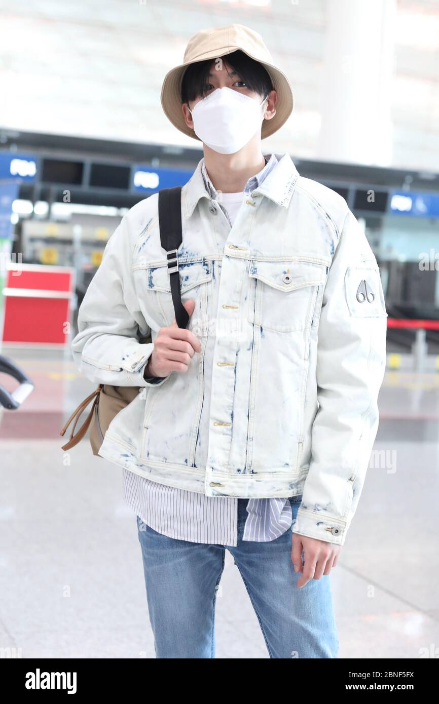 Chinese actor Zhang Yunlong arrives at a Beijing airport before ...
