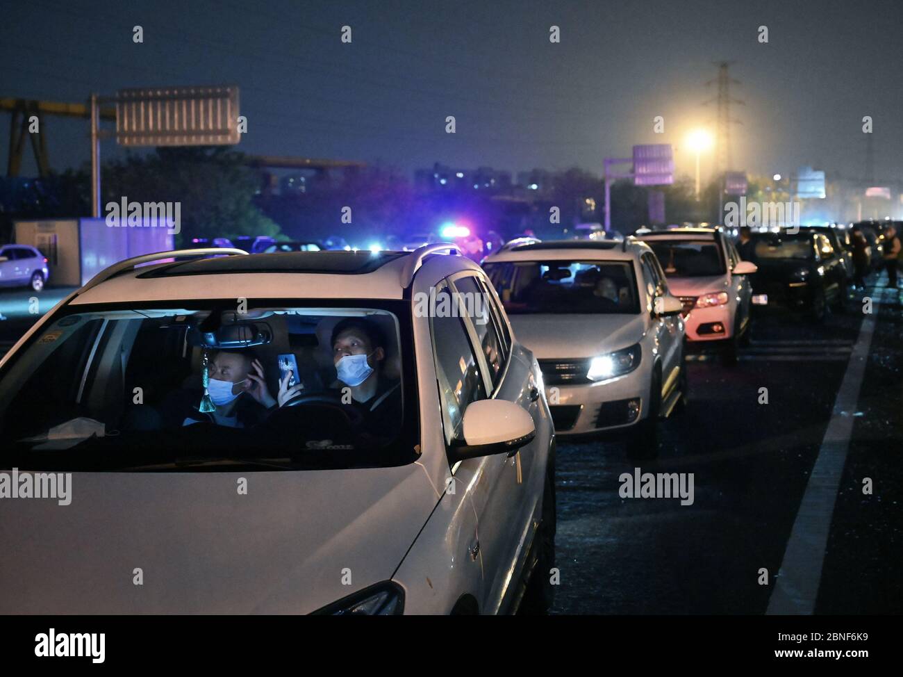 An aerial view of vehicles queueing at the entrance of expressway and ...