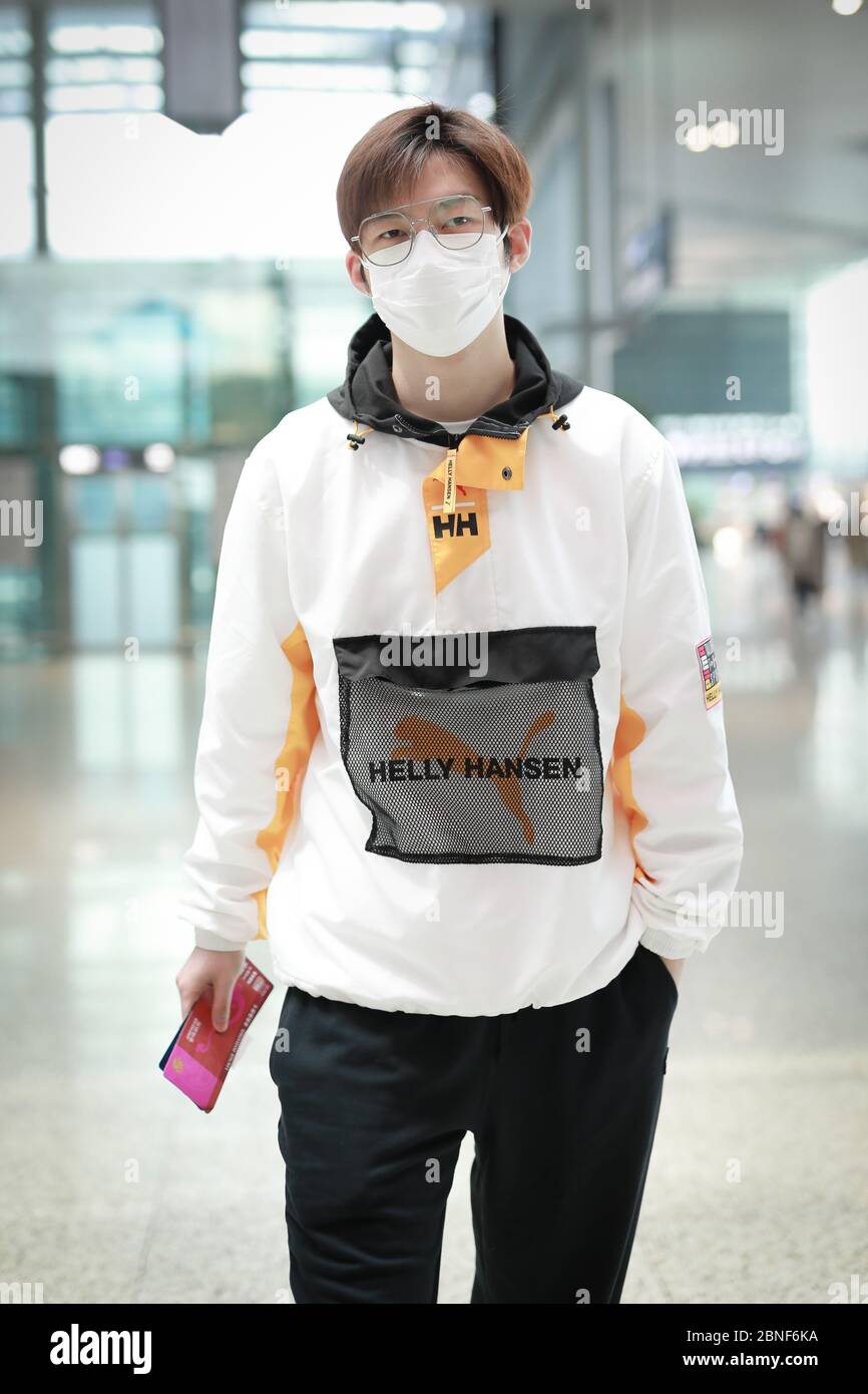 Chinese singer and actor Dong Li arrives at a Shanghai airport before ...