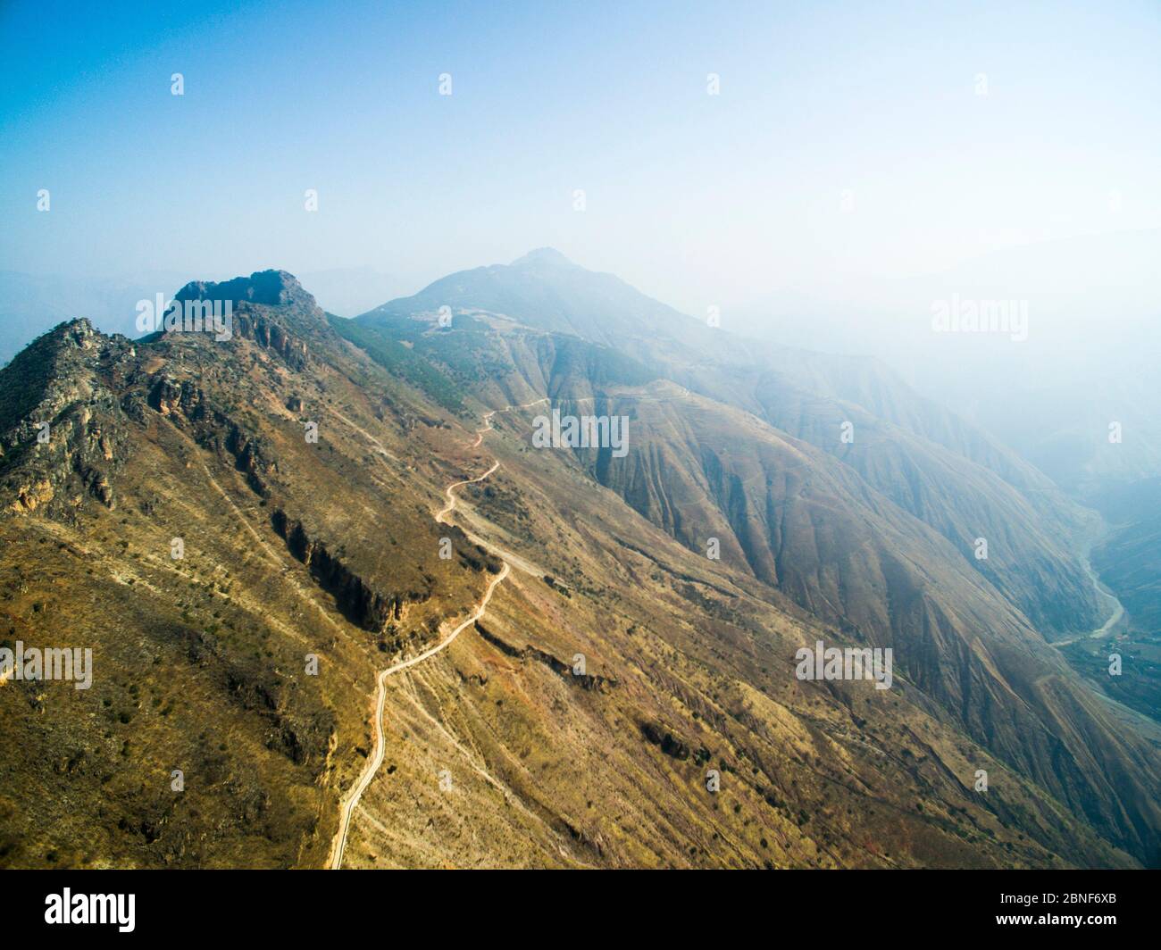 Aerial view of the zigzag mountain road in Xueshan Village in Kunming ...