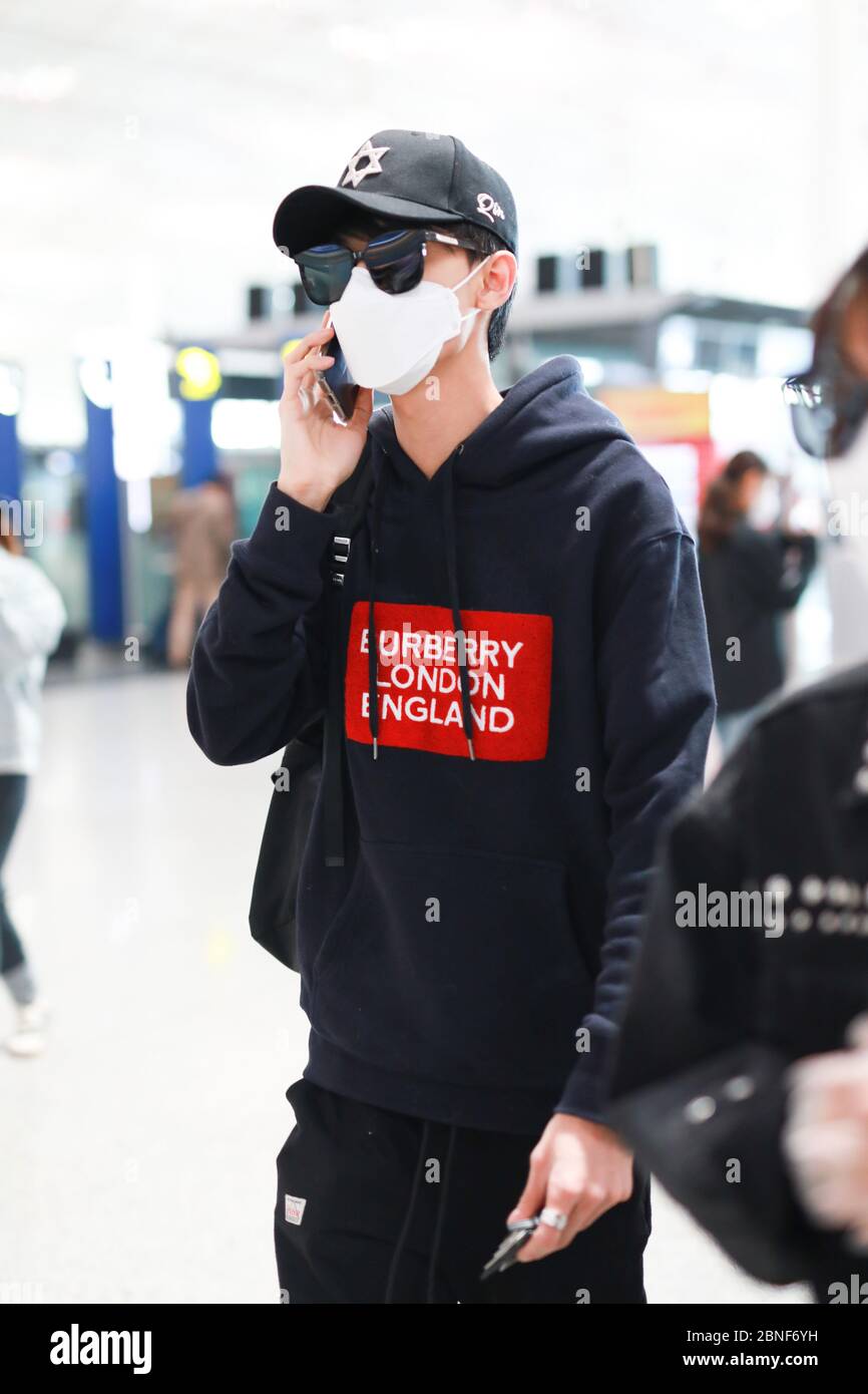Chinese cross-talk comedian Qin Xiaoxian arrives at a Beijing airport ...