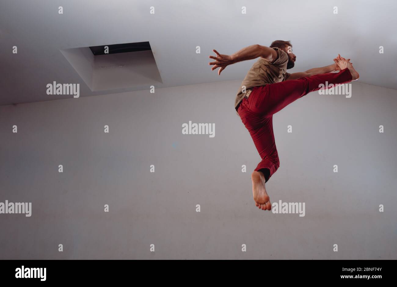 Handsome young man performing a contemporary dance routine Stock Photo ...
