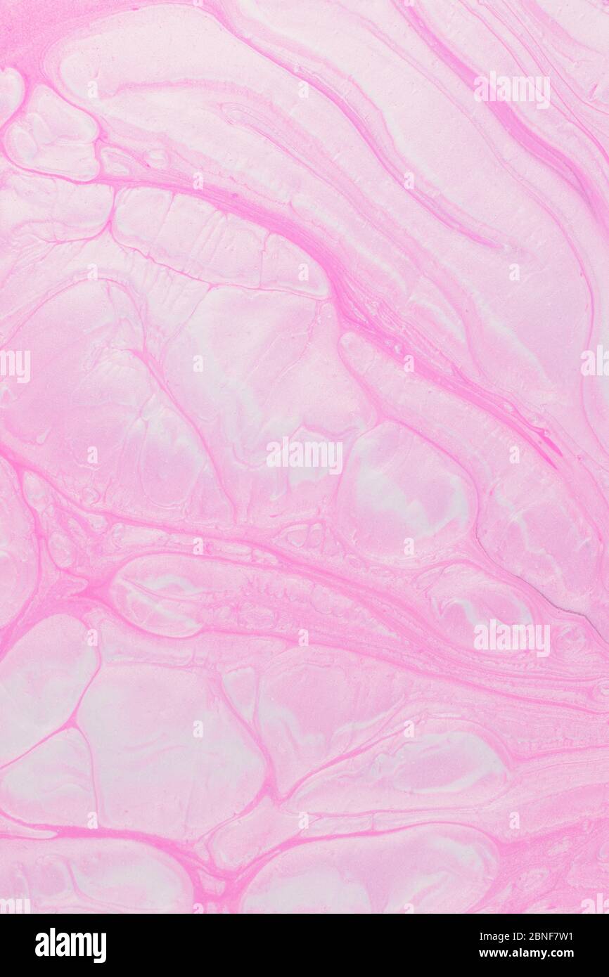 A vertical shot of a beautiful background in oily pink pastel color ...