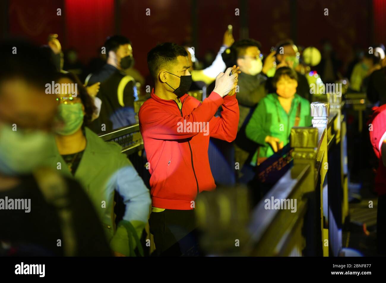 Tourists with face mask on at Grand Tang Dynasty Ever Bright City, a ...