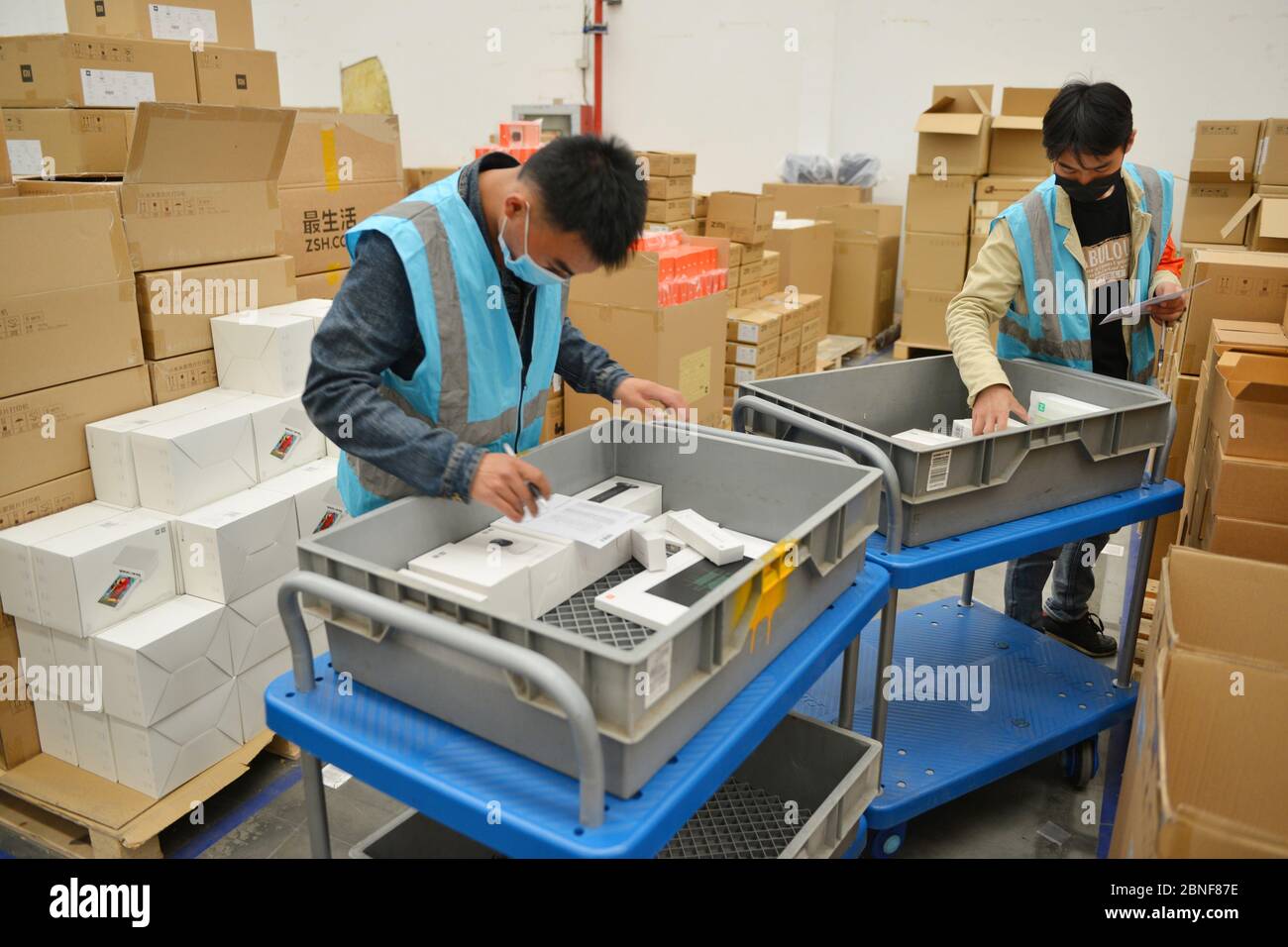 In logistics center of Suning Commerce Group, workers are busy ...