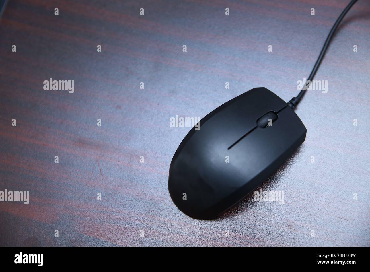Mouse Red furniture on the table . A black computer mouse Stock Photo ...