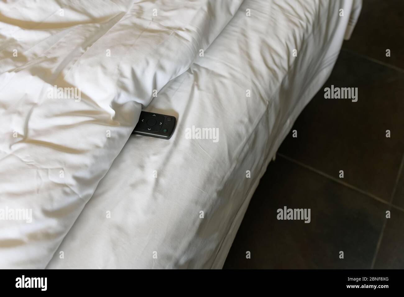 remote control on the bed Stock Photo - Alamy