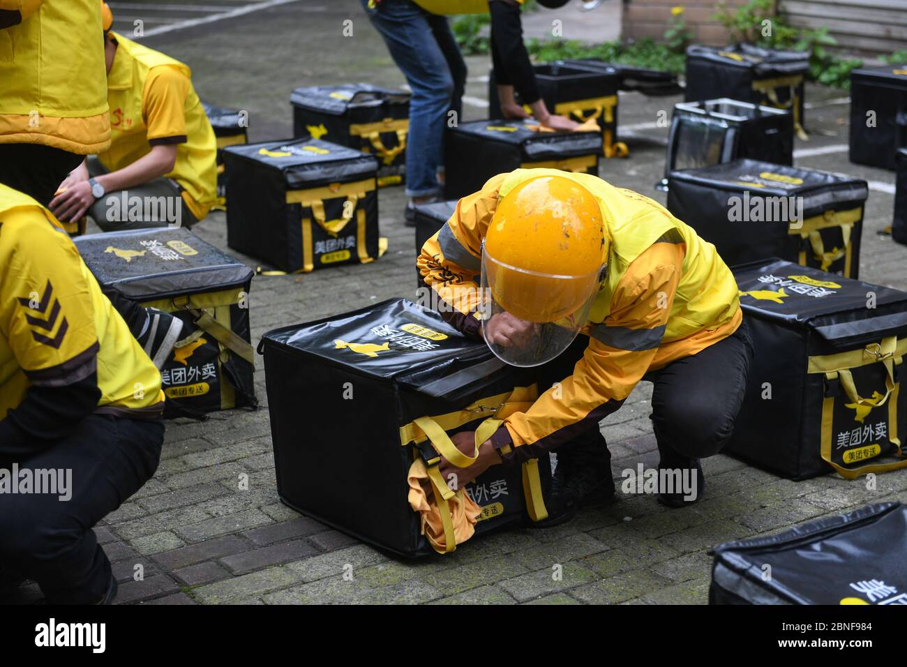 At a site of Meituan Food Delivery, deliverymen are taking everyday's ...