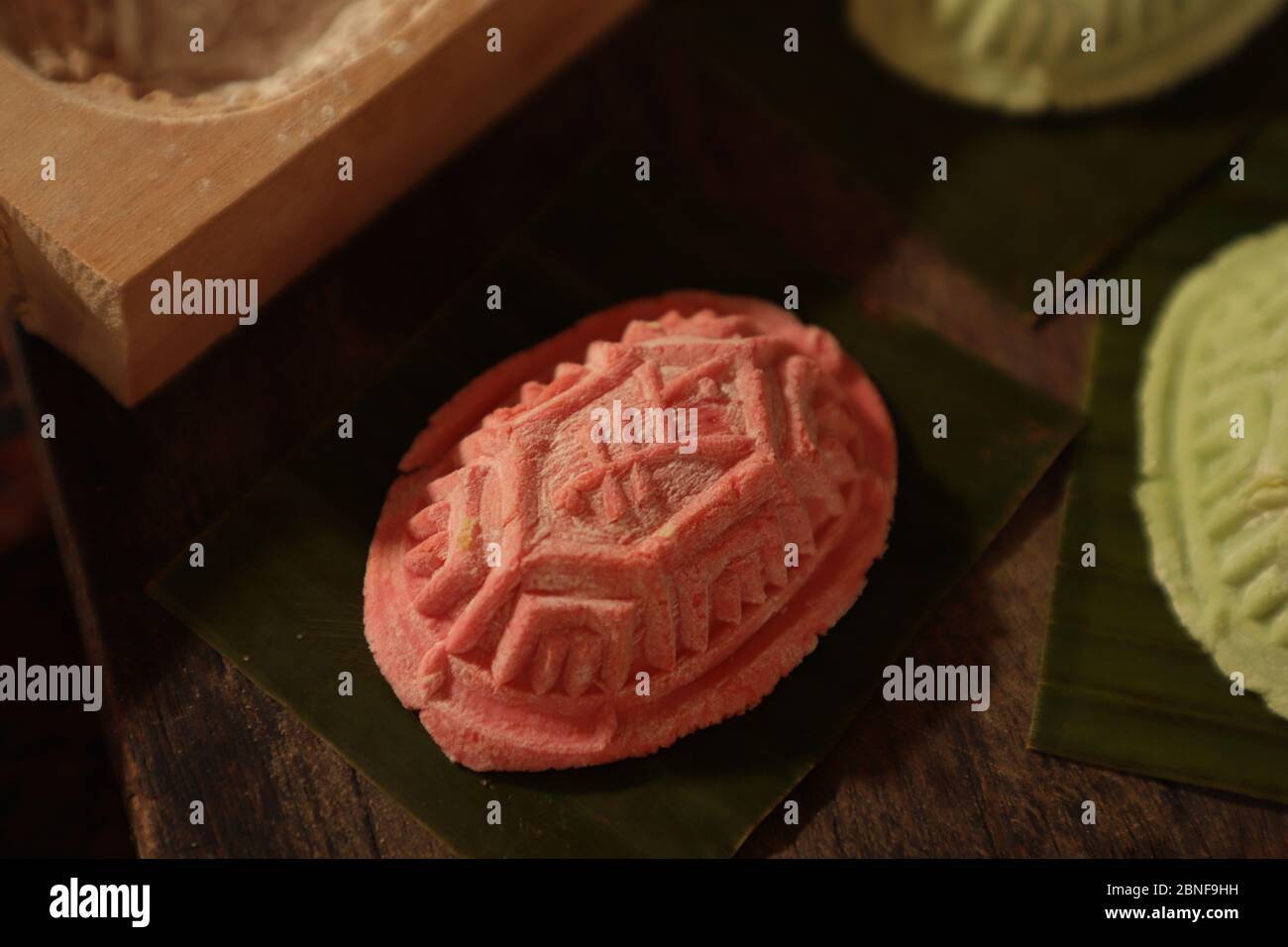 Making Ang Ku Kuih. Uncooked Ang Ku Kuih that have been taken off the ...