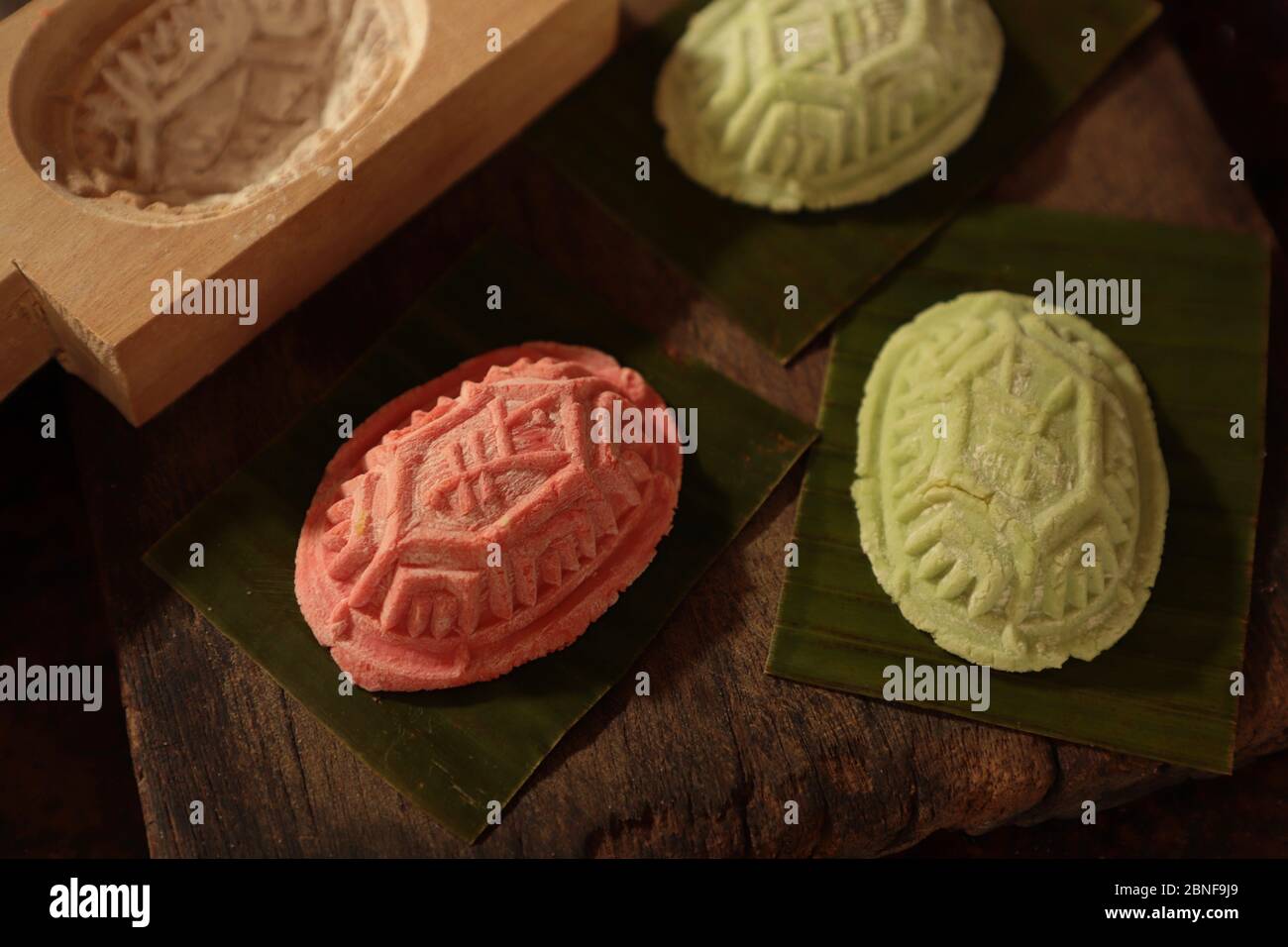 Making Ang Ku Kuih. Uncooked Ang Ku Kuih that have been taken off the ...