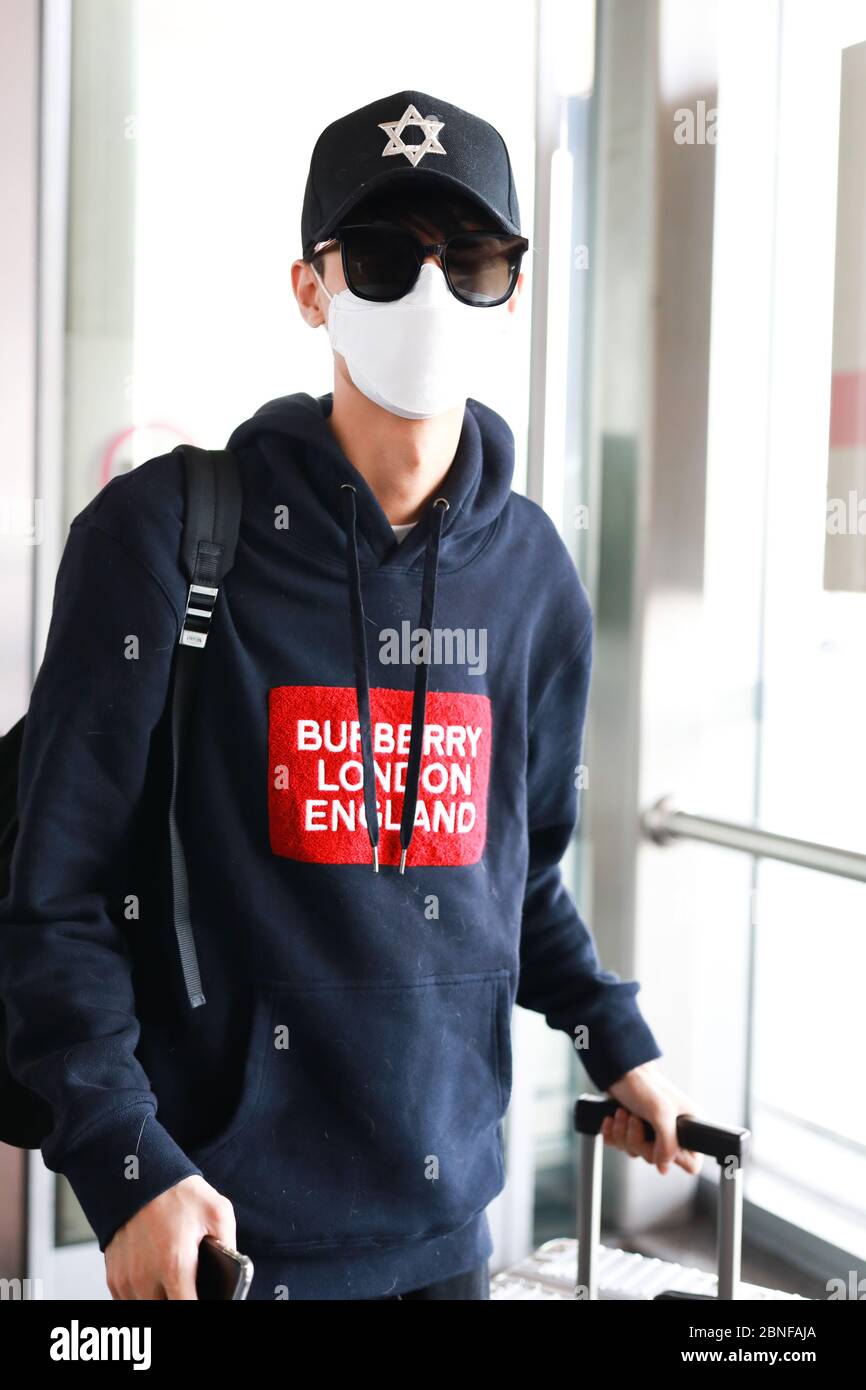 Chinese cross-talk comedian Qin Xiaoxian arrives at a Beijing airport ...