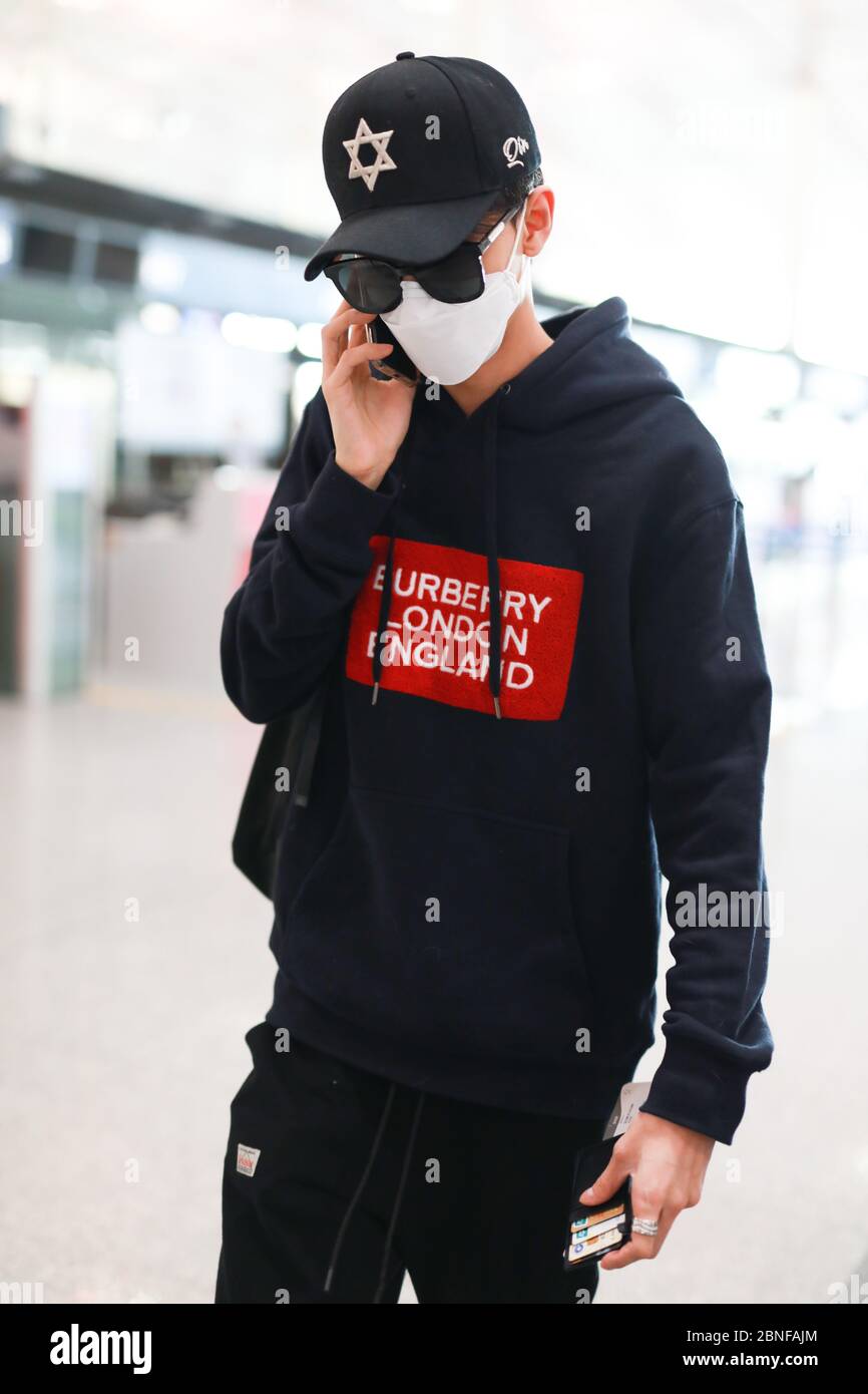 Chinese cross-talk comedian Qin Xiaoxian arrives at a Beijing airport ...