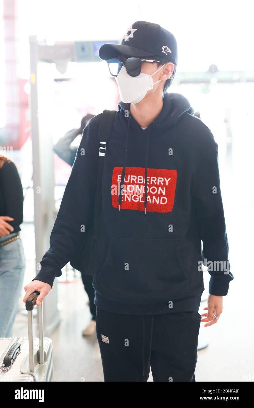 Chinese cross-talk comedian Qin Xiaoxian arrives at a Beijing airport ...