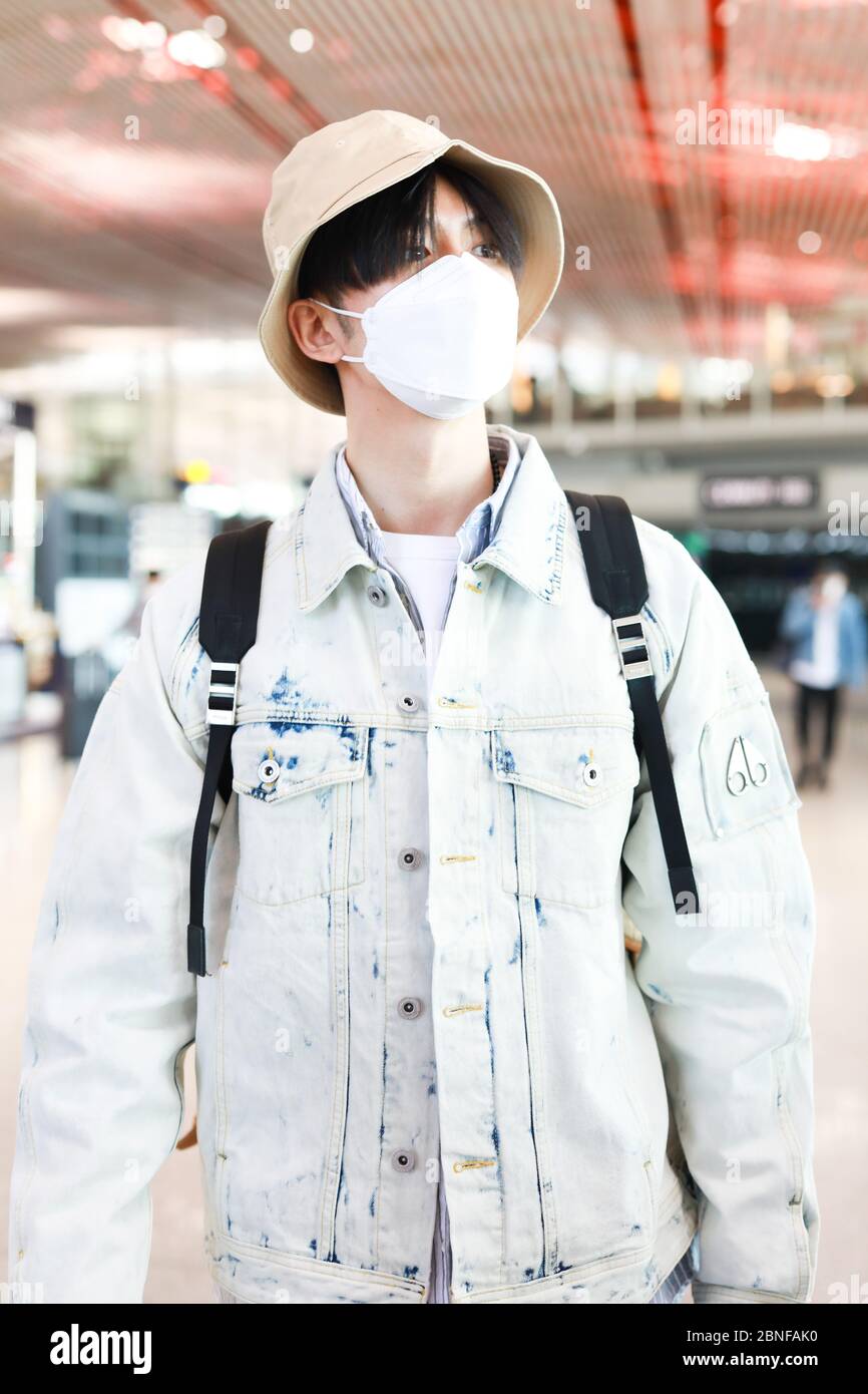 Chinese actor Zhang Yunlong arrives at a Beijing airport before ...