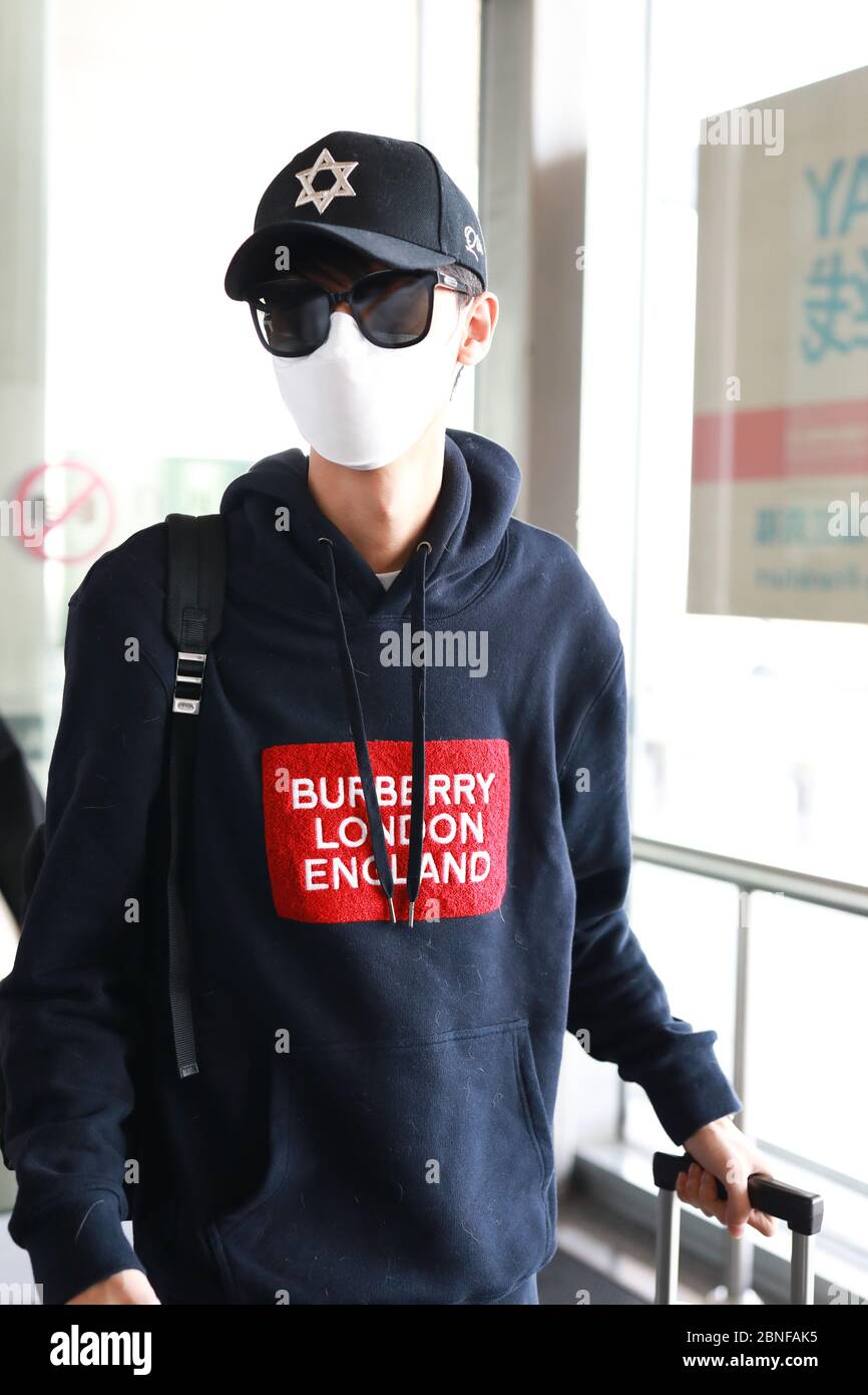 Chinese cross-talk comedian Qin Xiaoxian arrives at a Beijing airport ...